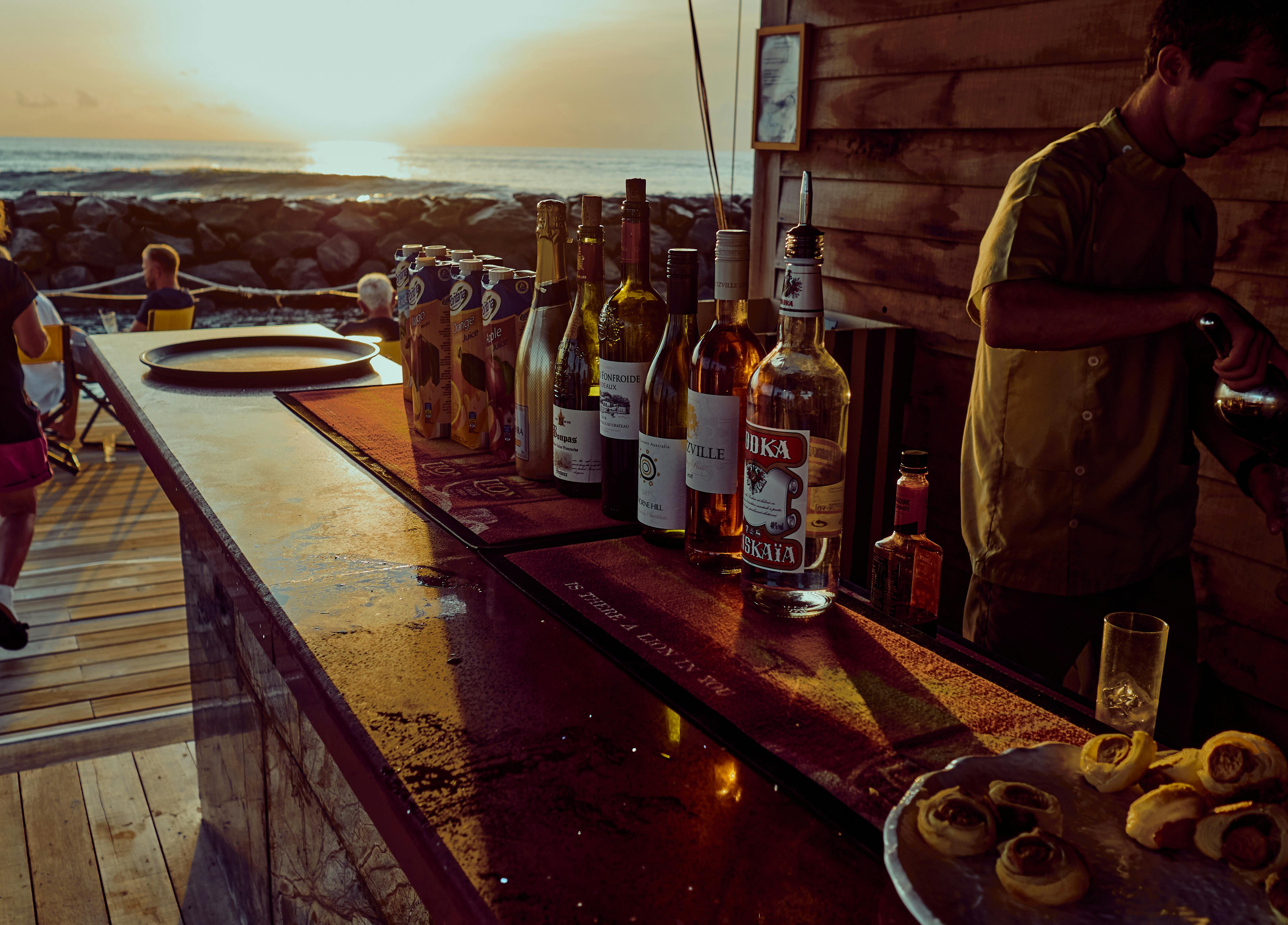 Alcohol Bottles on Bar Counter · Free Stock Photo