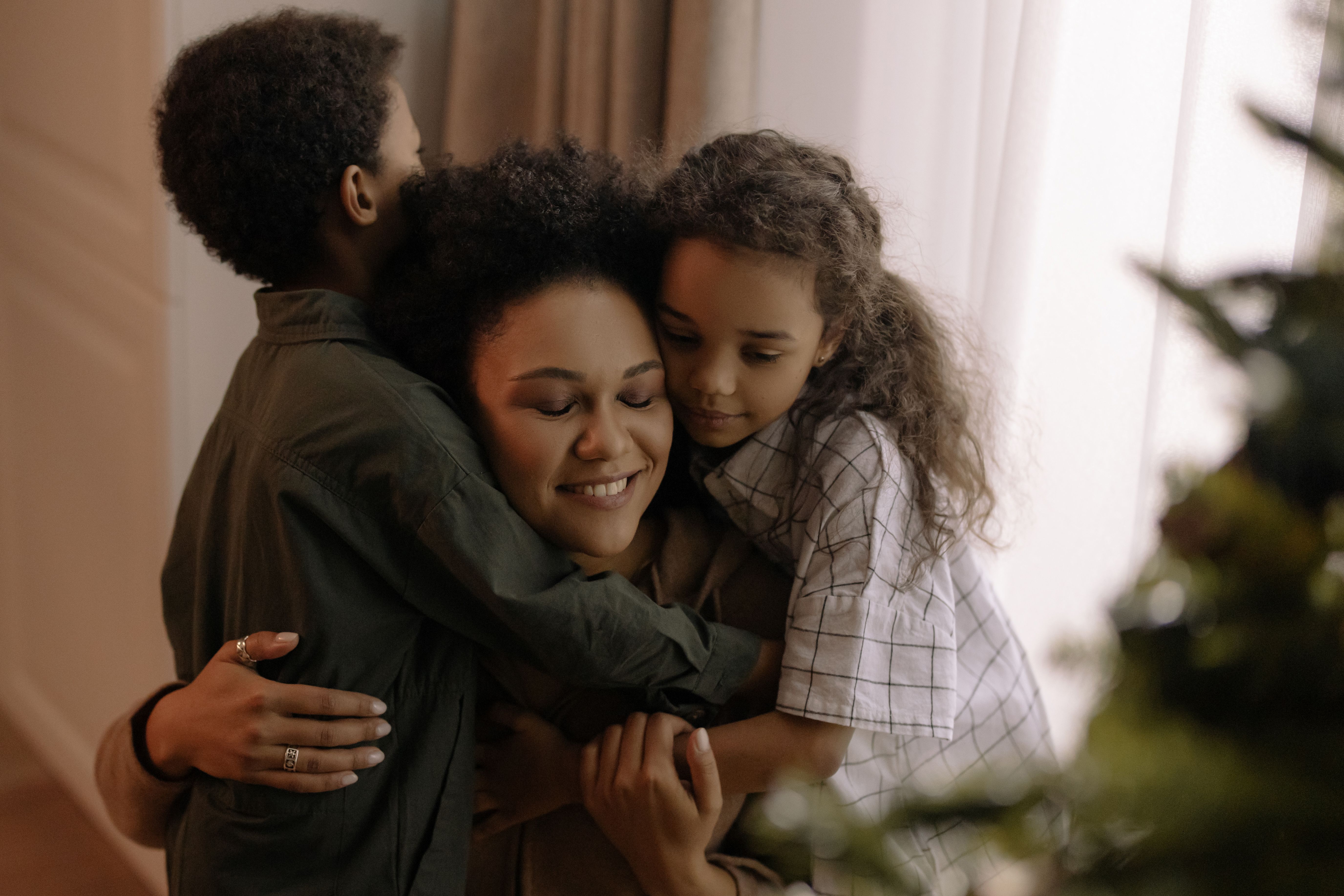 A Woman Hugging Her Children · Free Stock Photo