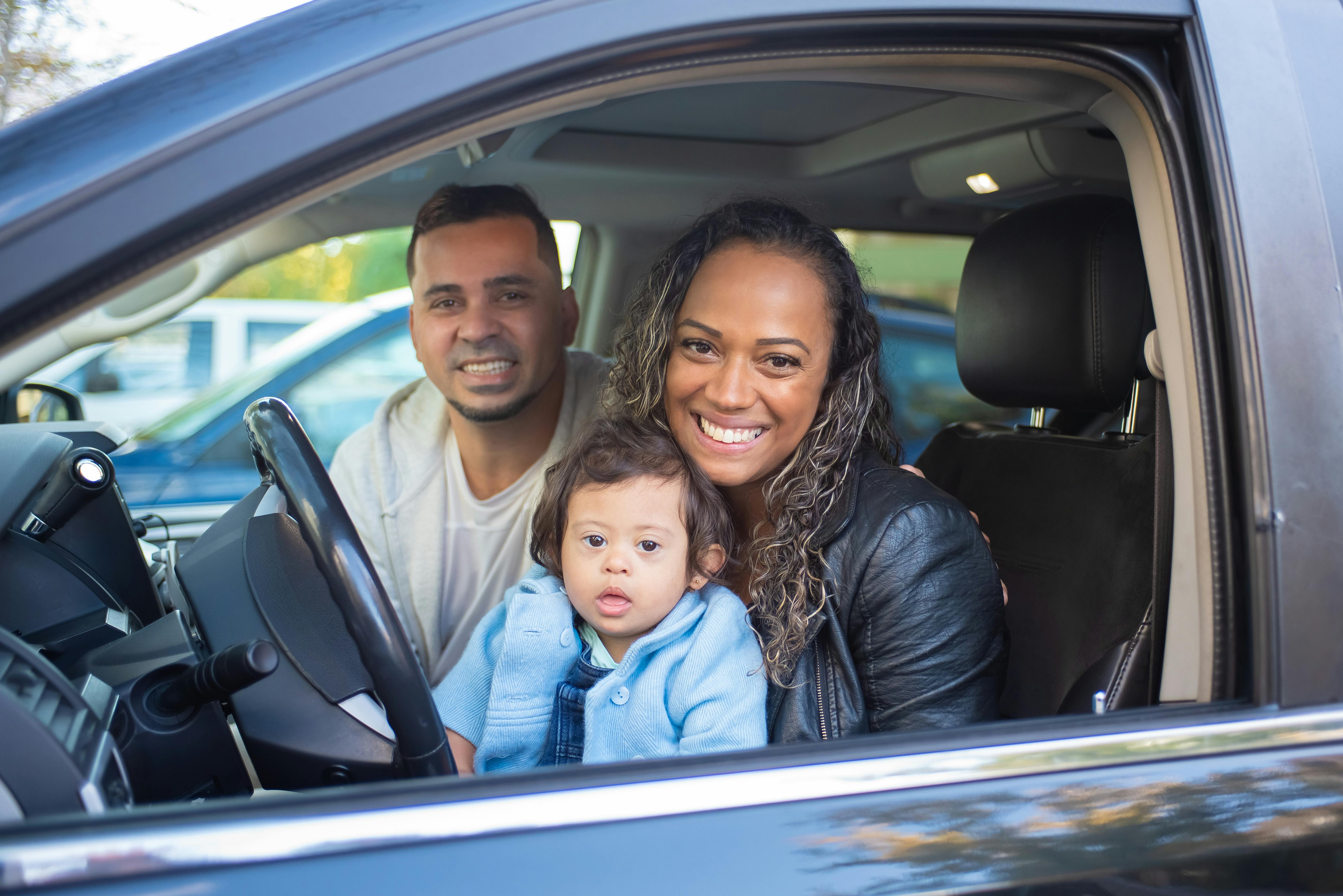 Parents inside a Car with Their Child · Free Stock Photo