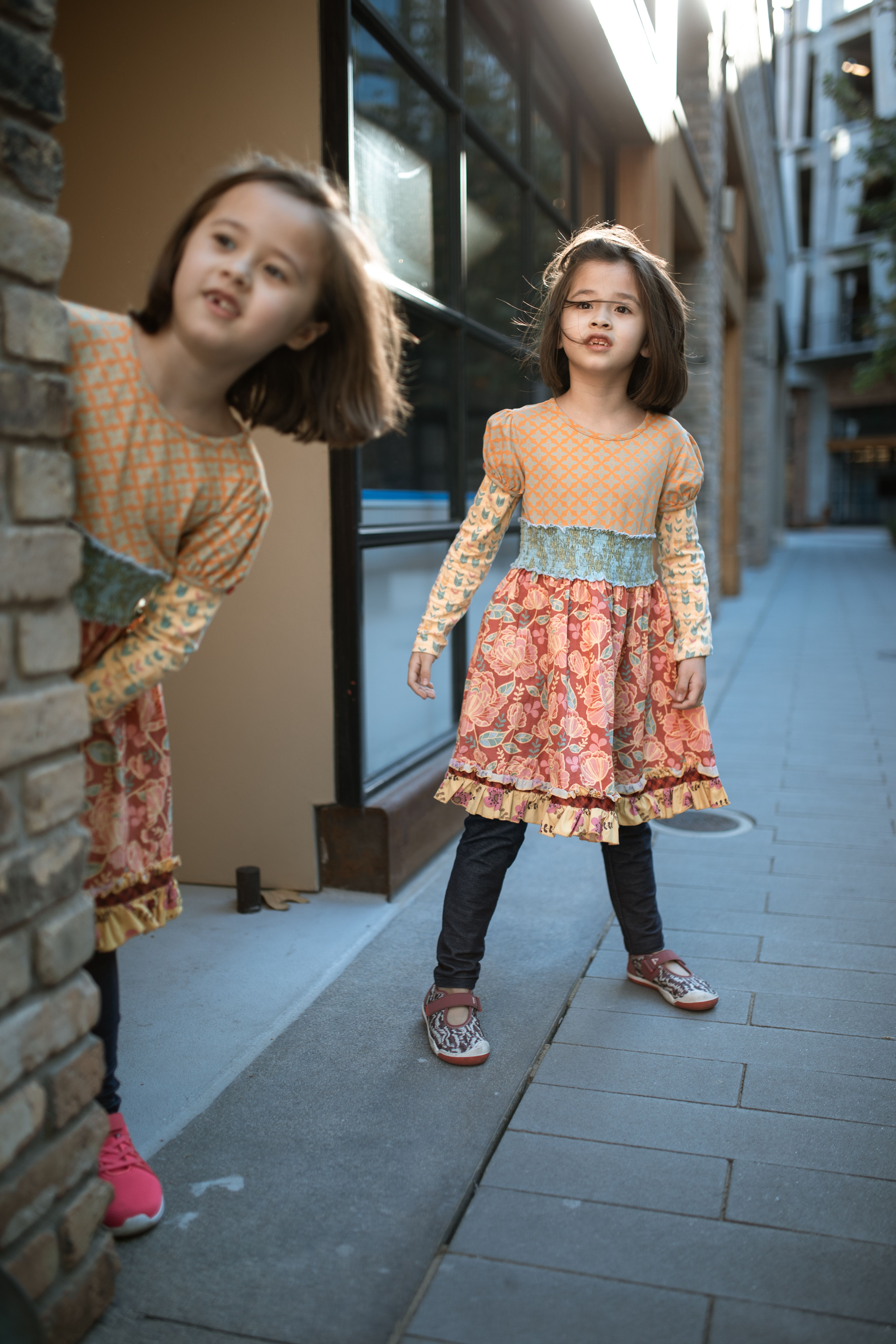 Girls Wearing Orange Dress Looking Afar · Free Stock Photo