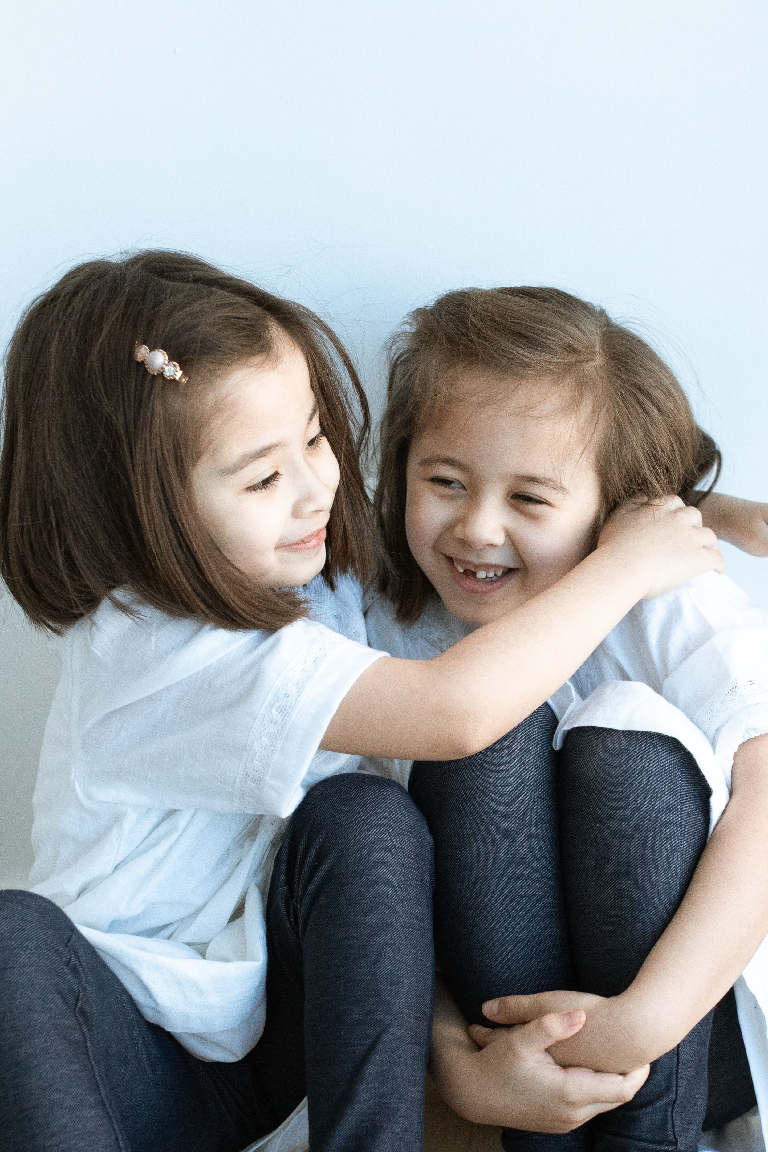 Little Girl Hugging a Woman · Free Stock Photo
