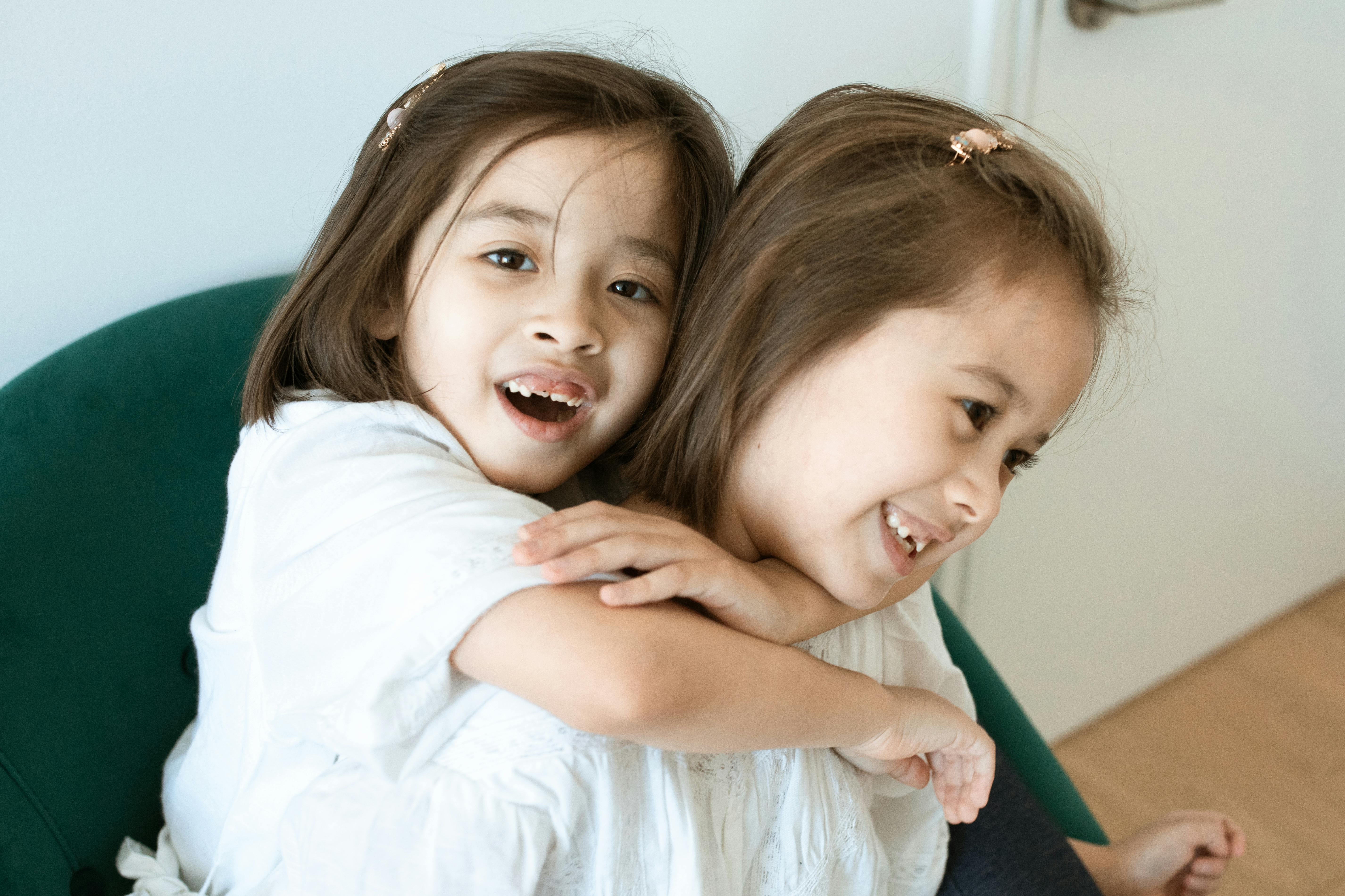 Girls in White Shirt Hugging · Free Stock Photo