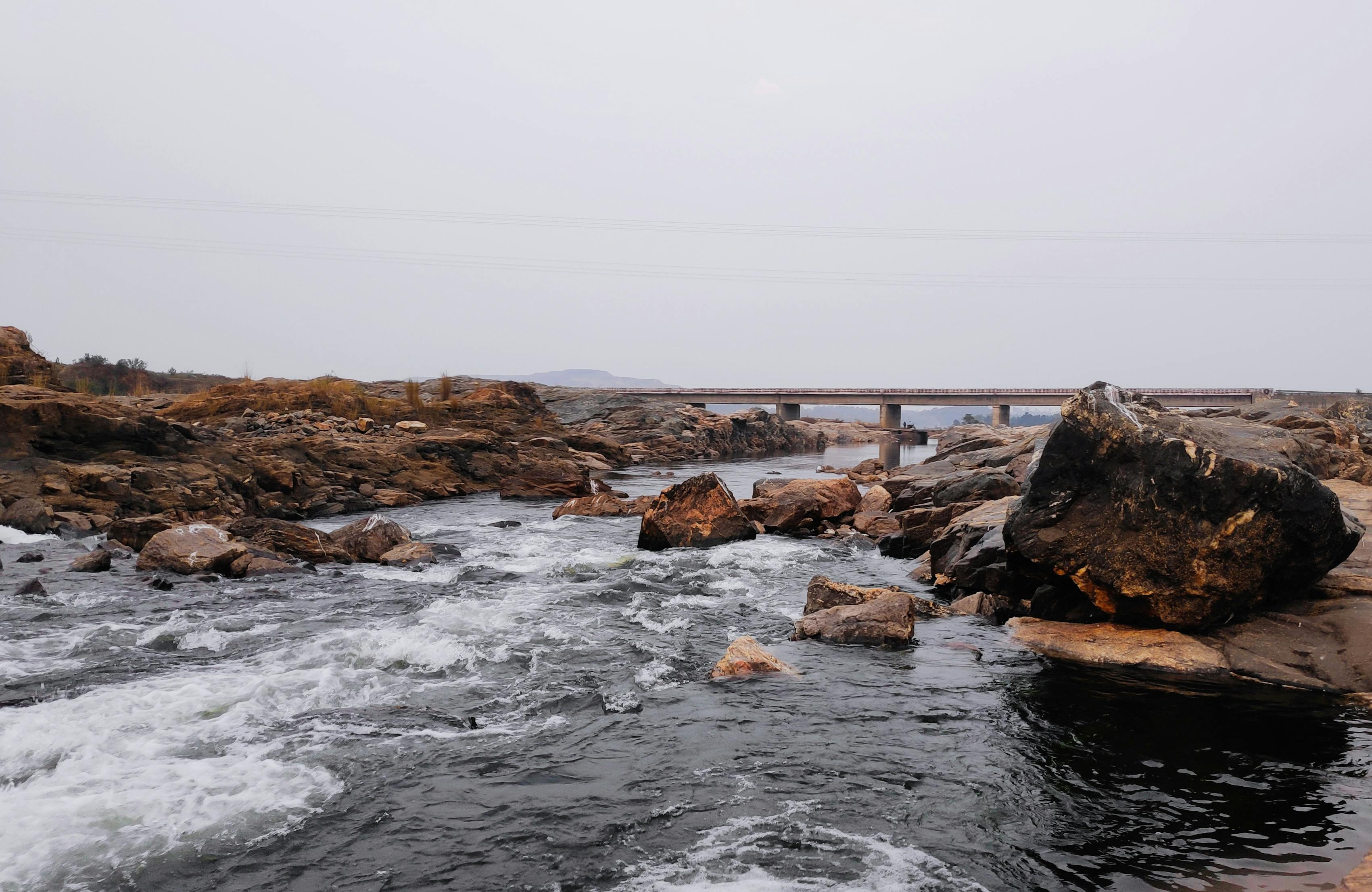 Rocks and Boulders in a Shallow River · Free Stock Photo