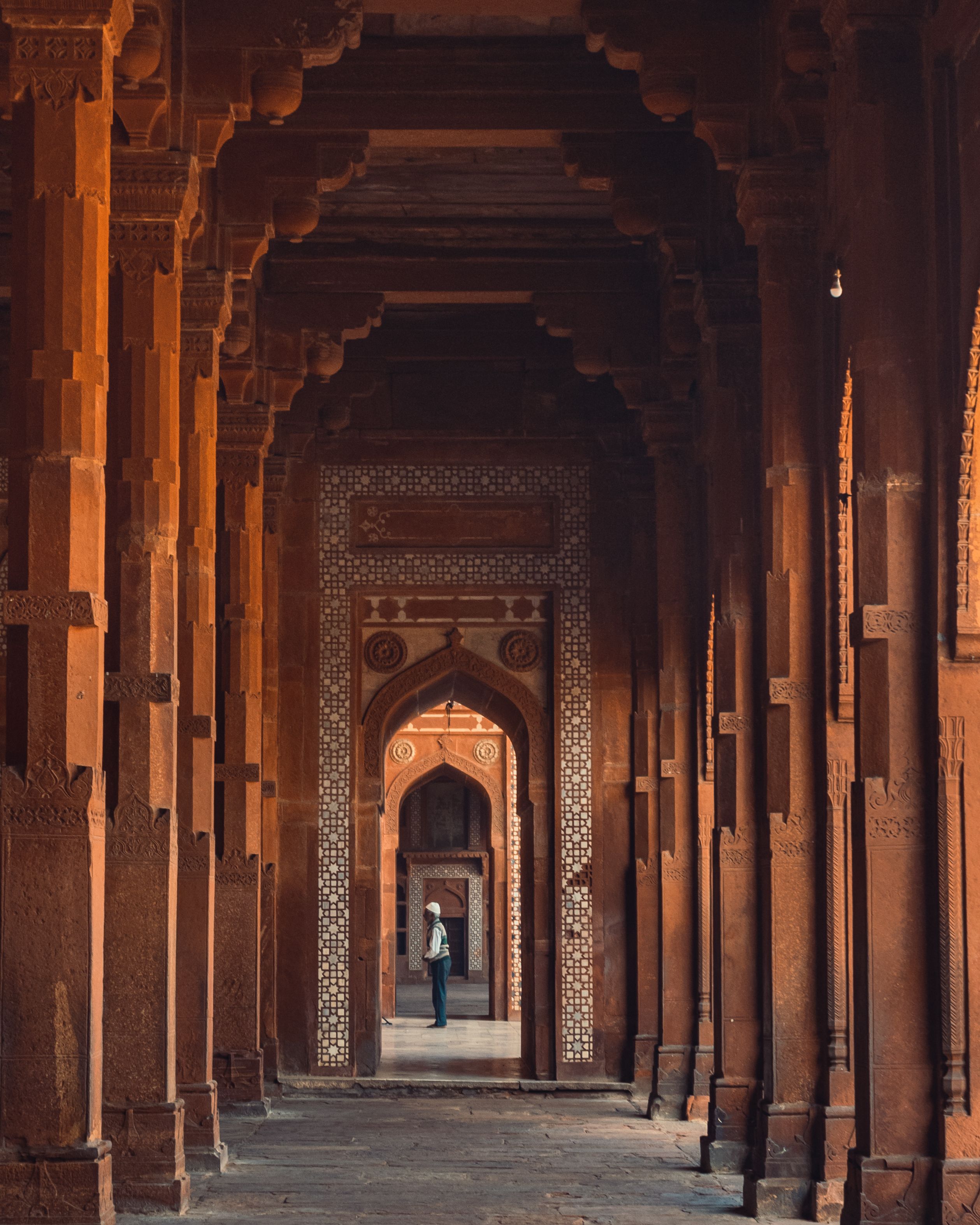 Hallway with Arched Brick Wall · Free Stock Photo