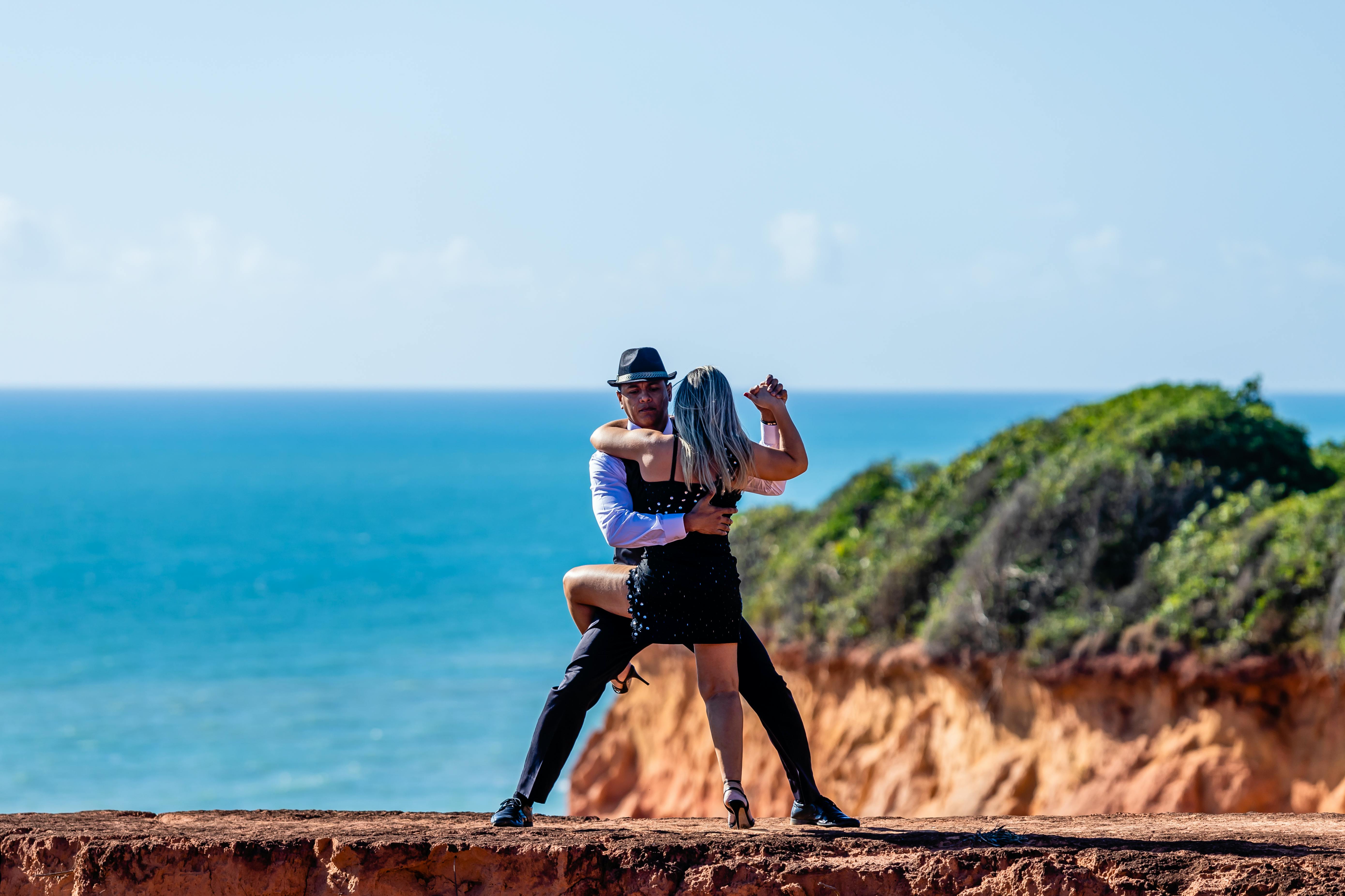 A Man and a Woman Dancing on a Cliff · Free Stock Photo