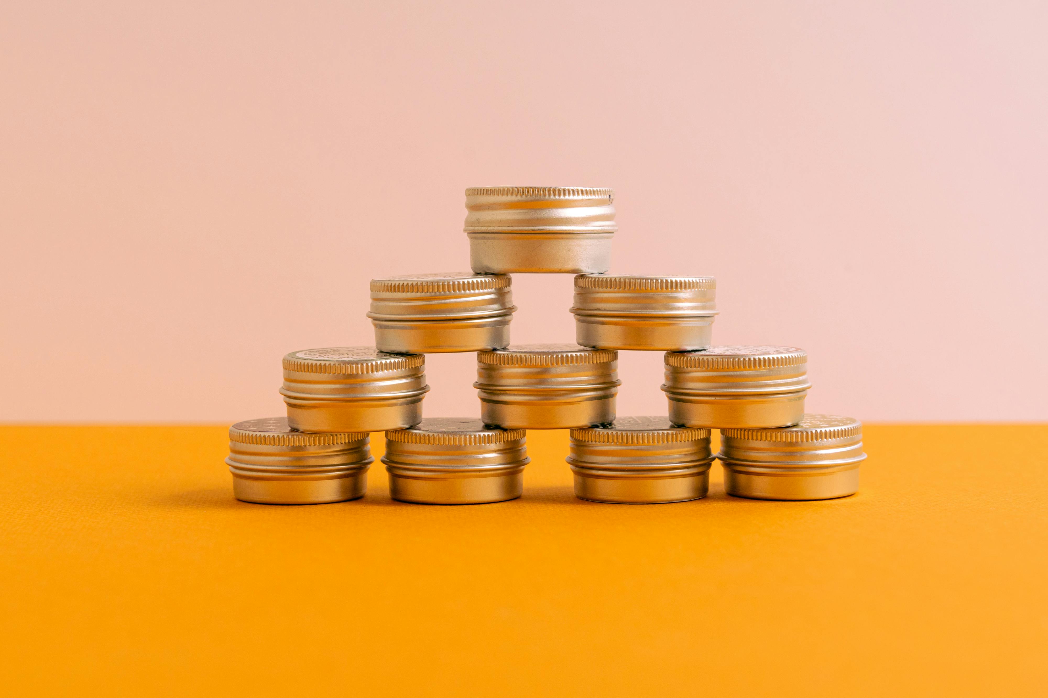 Close-Up Shot of Stack of Bottle Caps on an Orange Surface · Free Stock ...