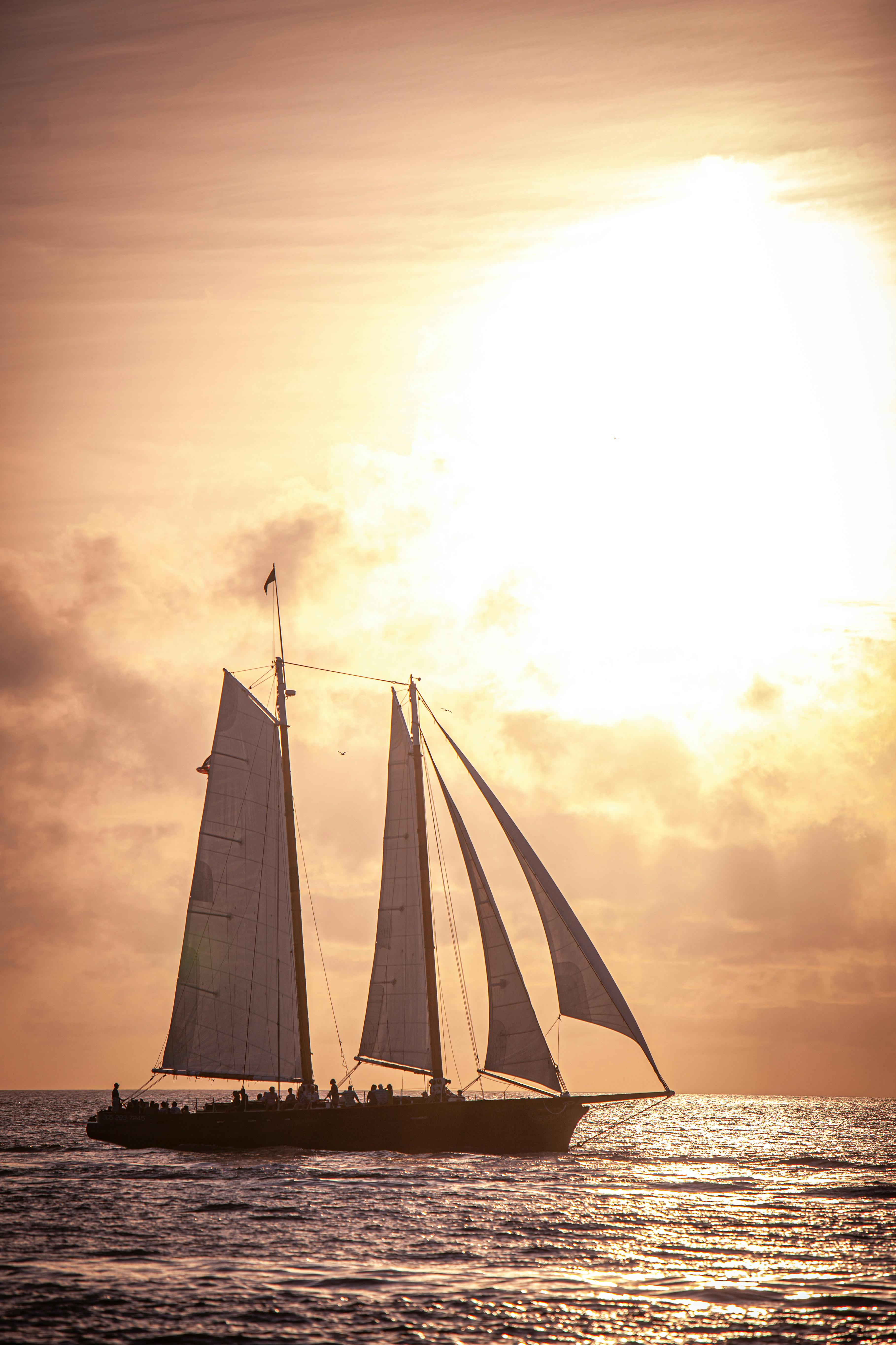 Sailboat at Sea During Sunset · Free Stock Photo