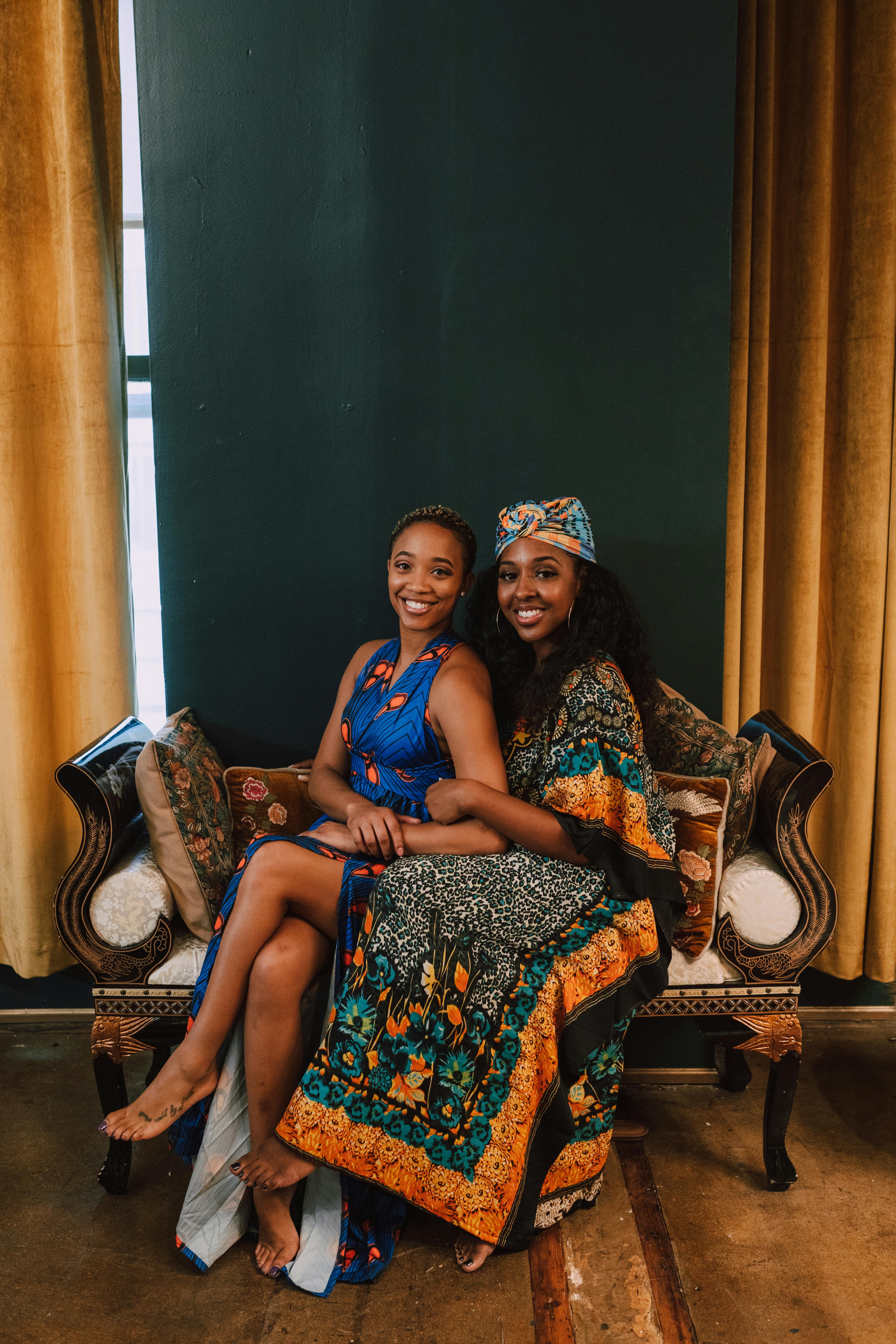 Photo Of Women Sitting Beside Each Other · Free Stock Photo