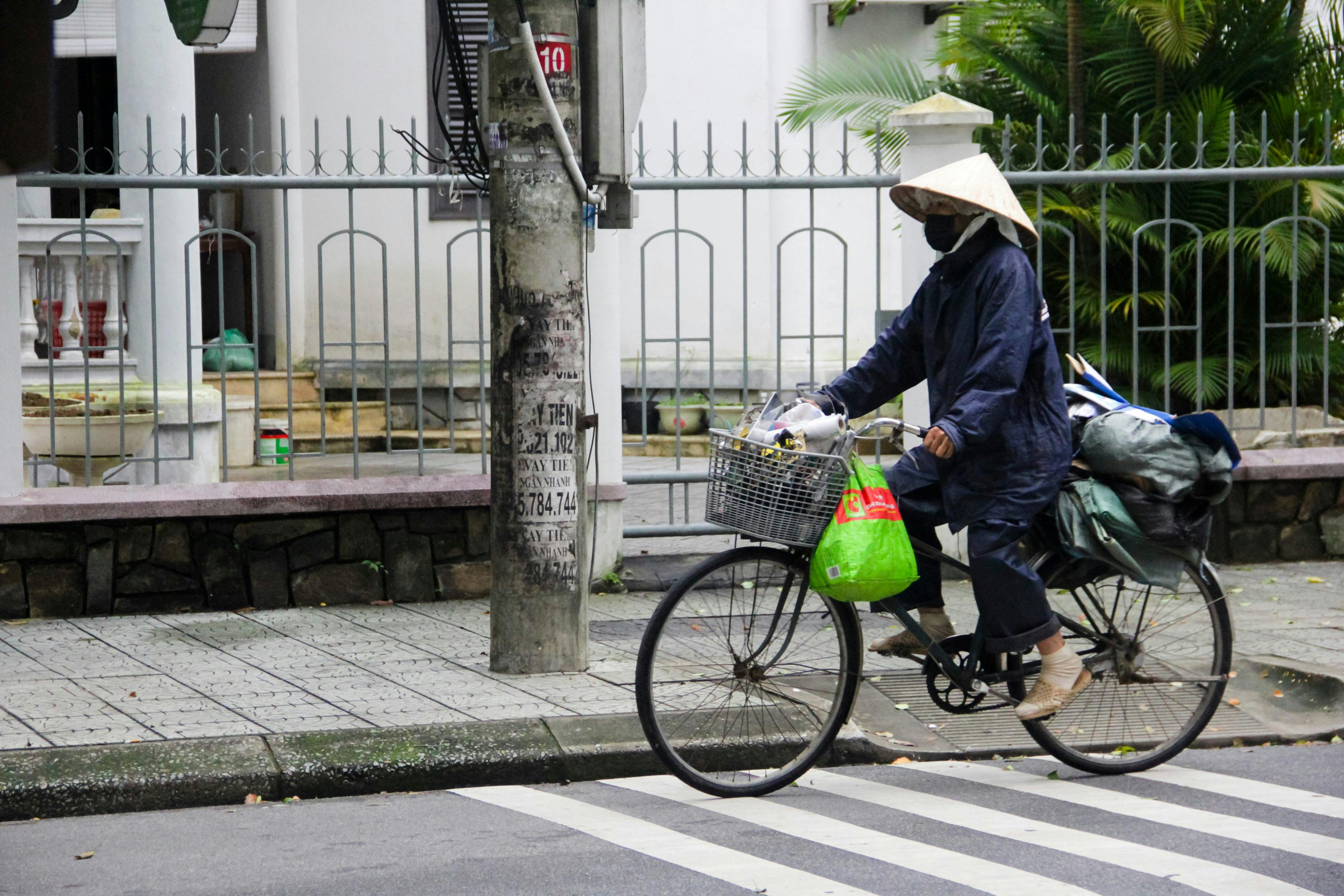 Photo of Person Riding a Scooted on Sidewalk · Free Stock Photo