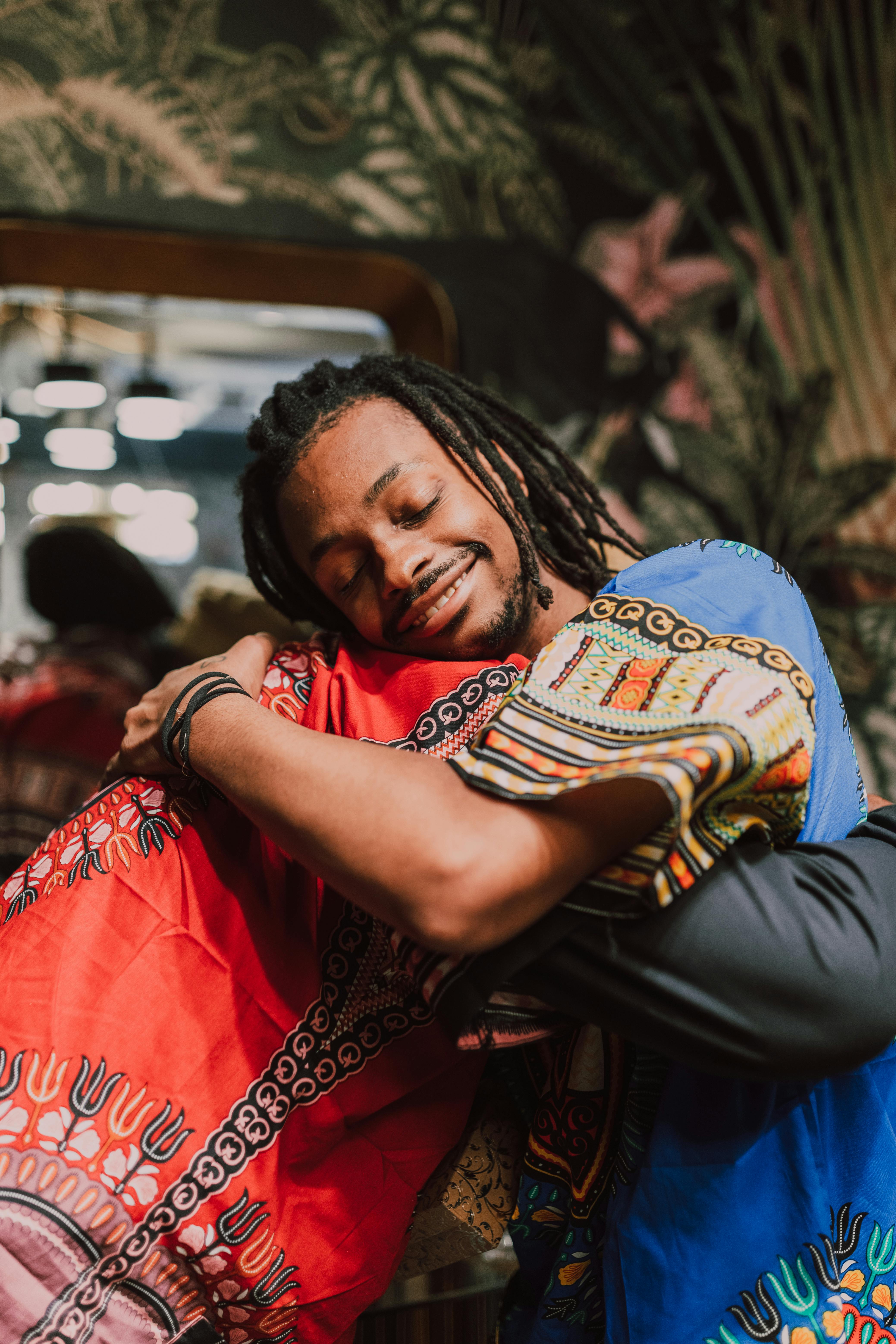 Two Men Hugging Each Other · Free Stock Photo