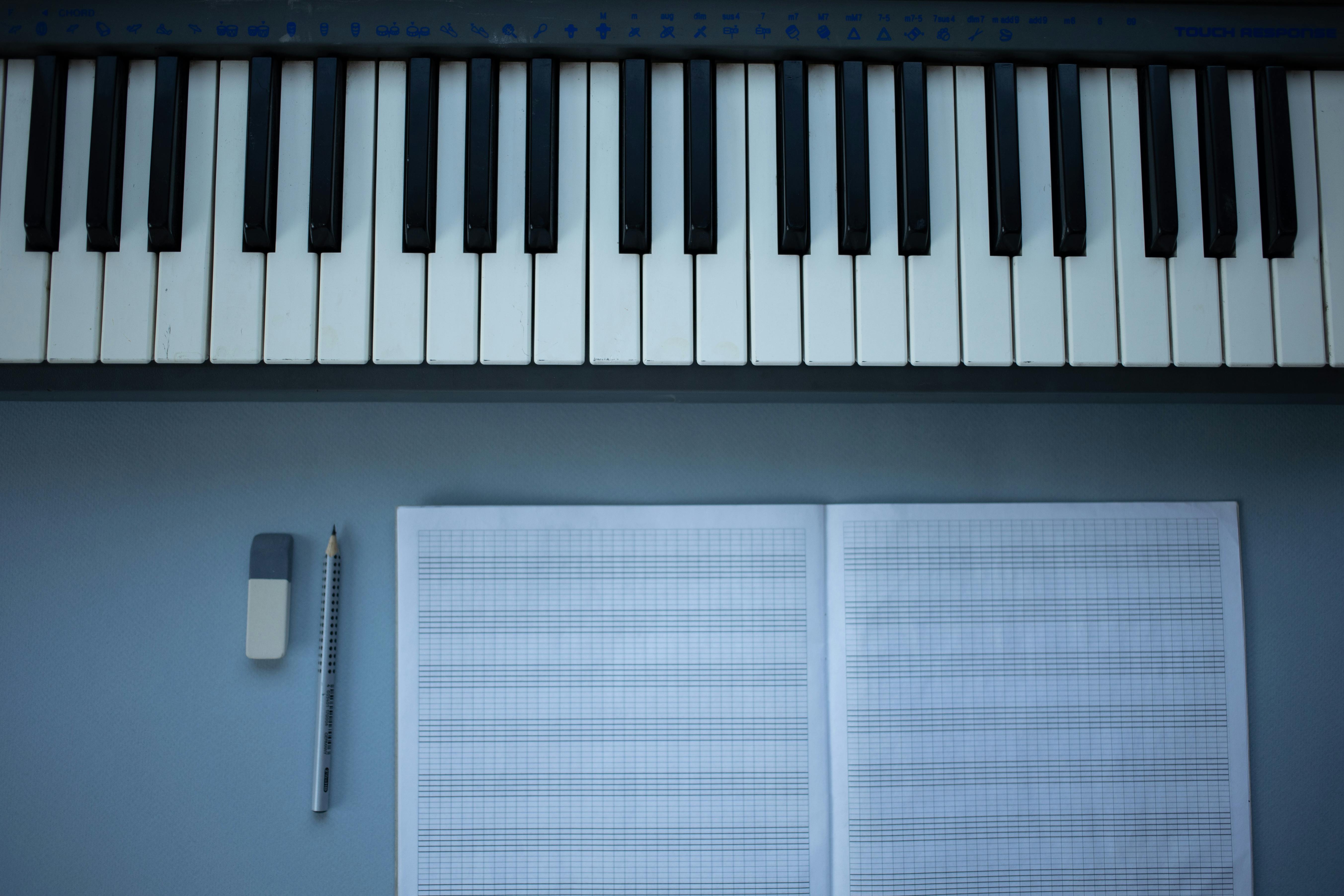 Piano Beside Music Sheet · Free Stock Photo