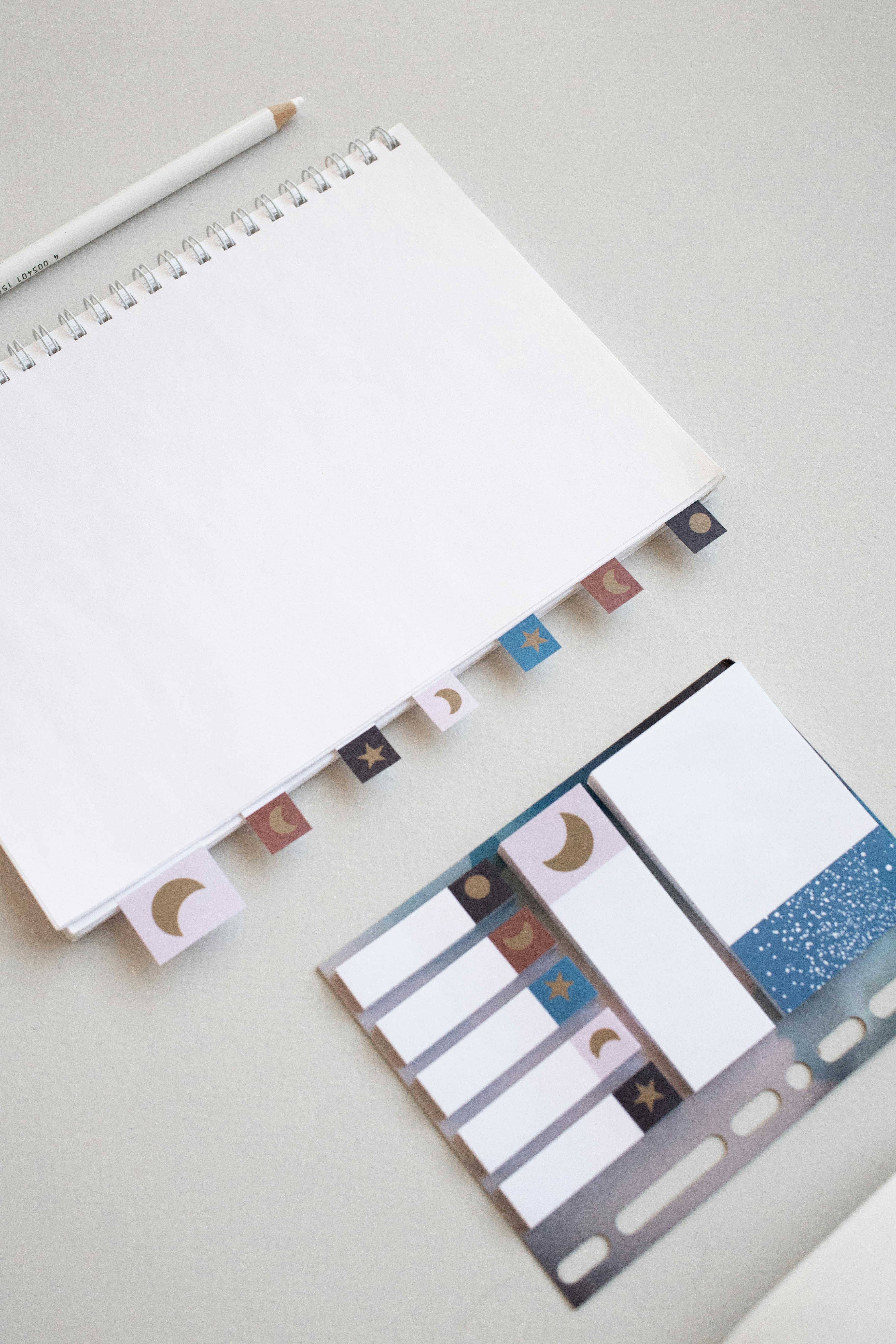 White Notebook and Stationery on a White Surface · Free Stock Photo