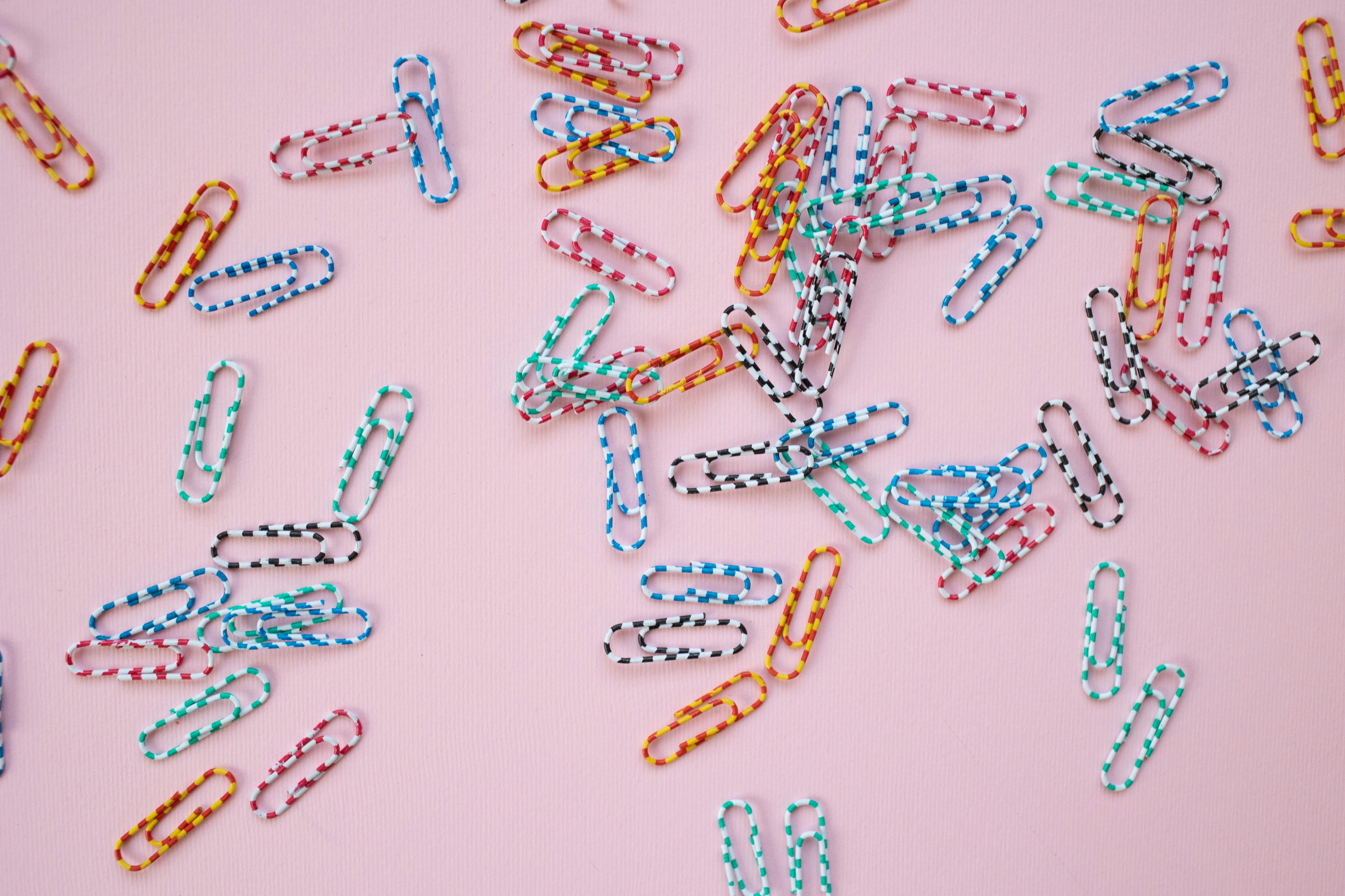 Paper Clips on a Pink Surface · Free Stock Photo