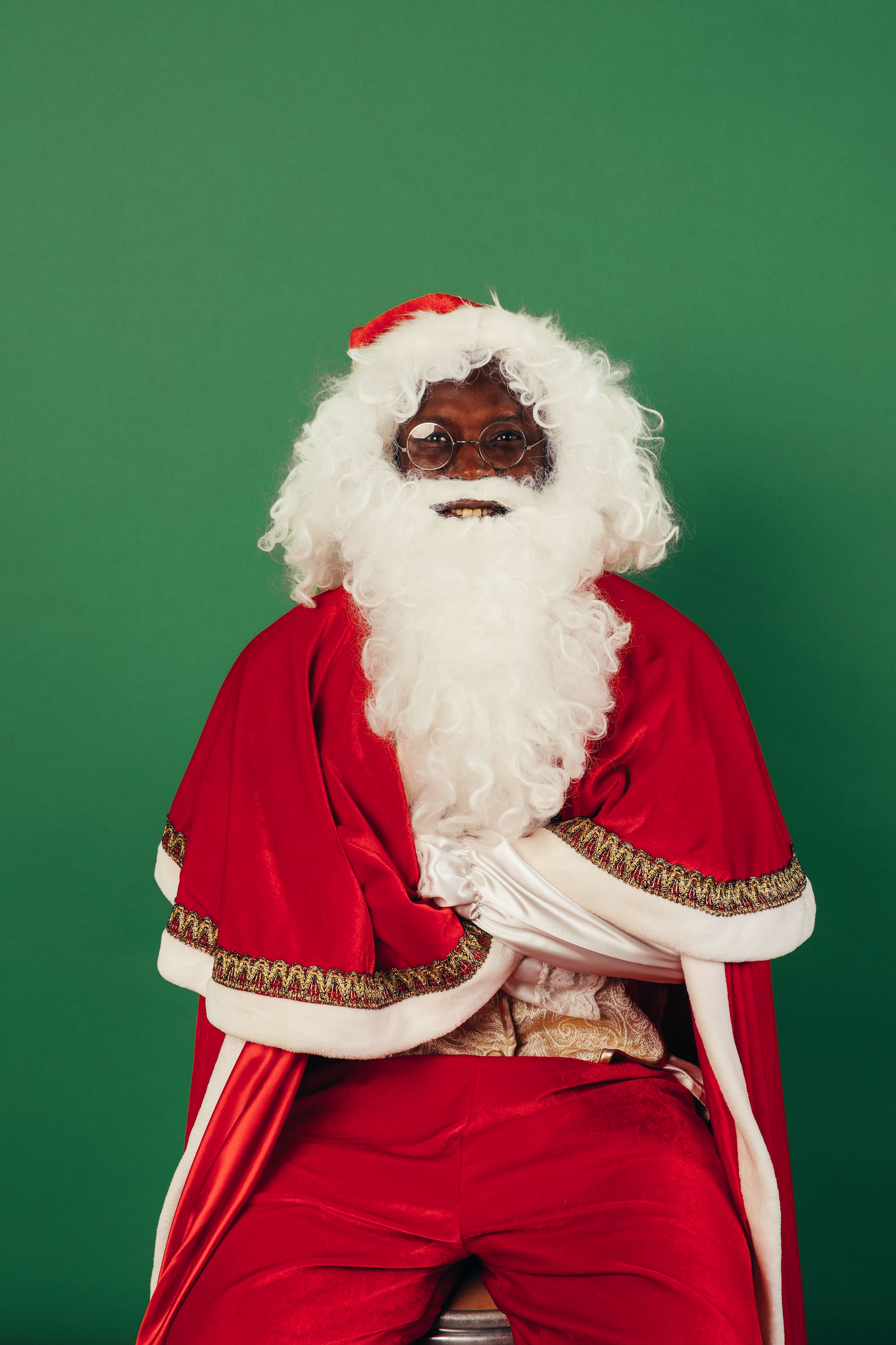 Santa Claus With Red Robe Sitting On A Chair · Free Stock Photo