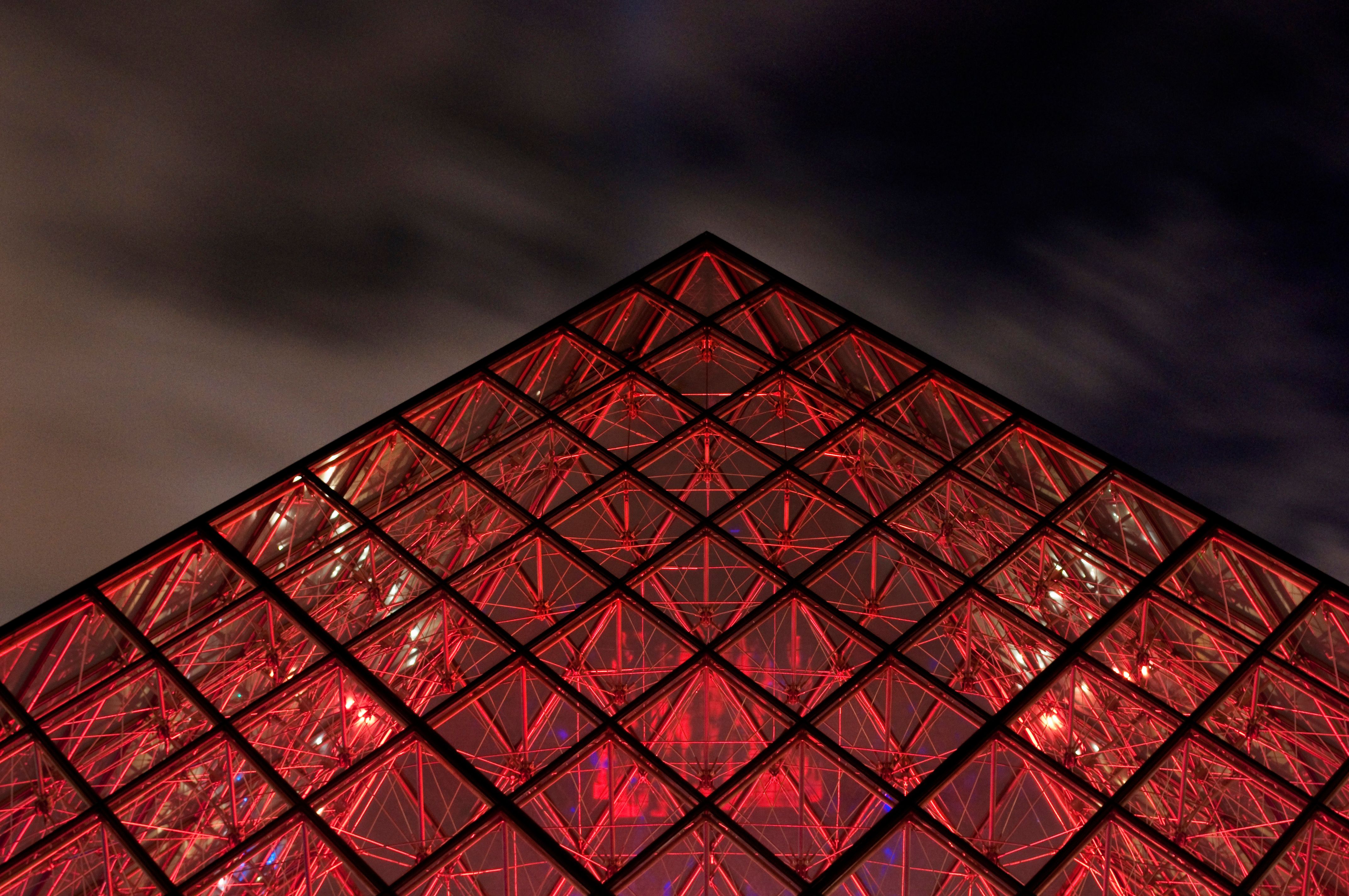 Close-up of the Tip of the Louvre Pyramid Illuminated in Bright Red ...