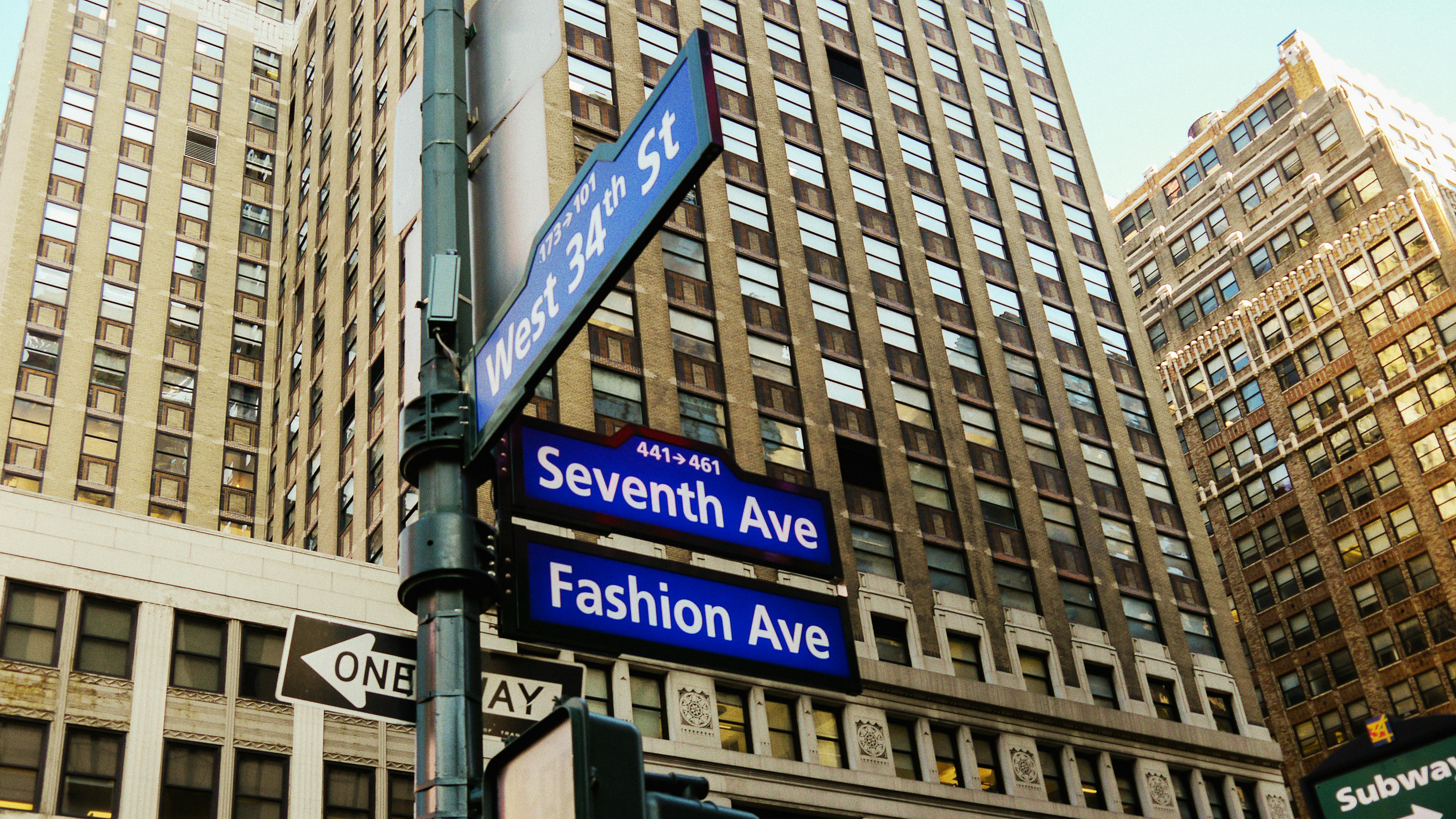 Blue Street Sign in Front of Skysc · Free Stock Photo