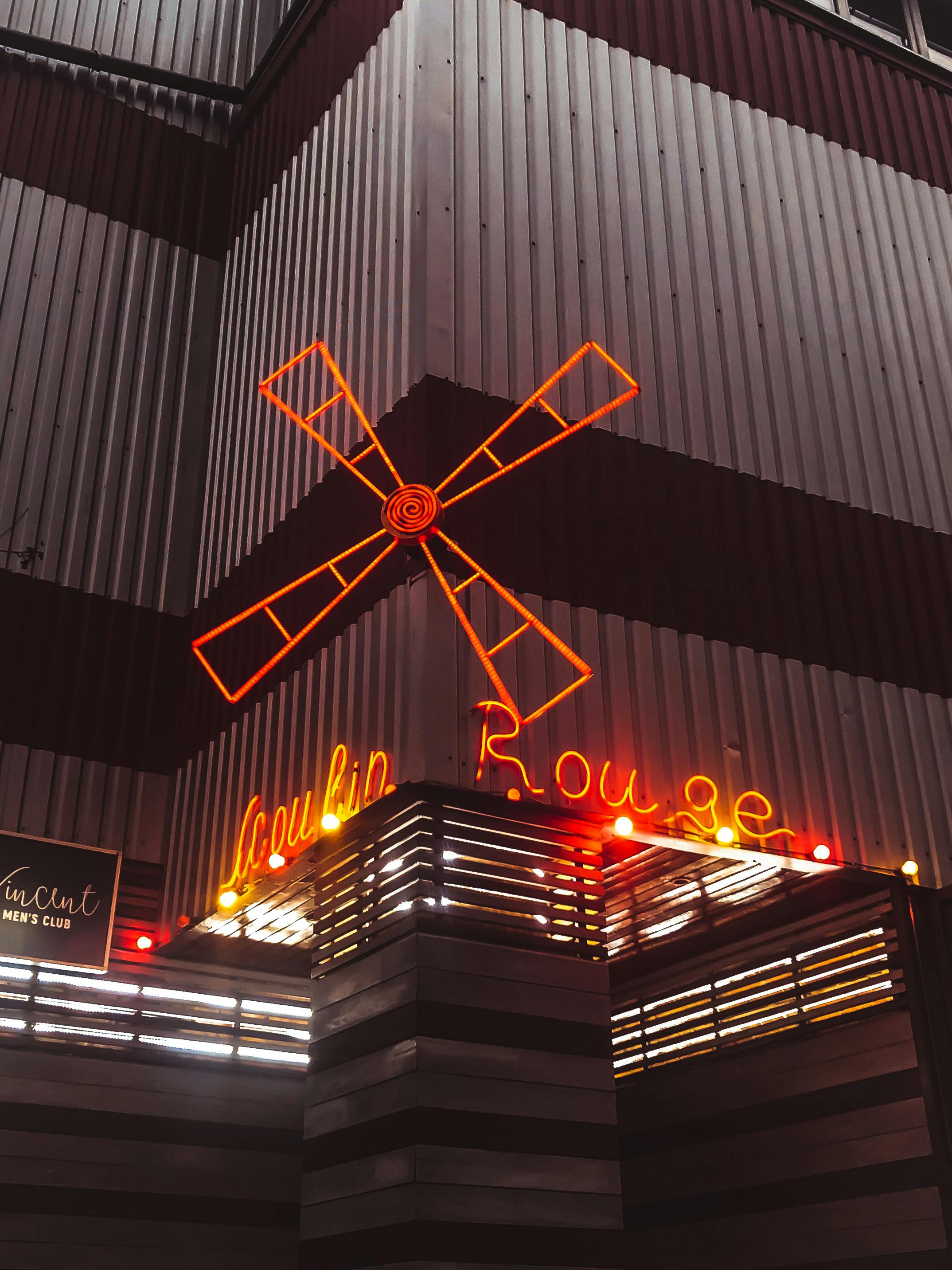 Neon Sign on a Building · Free Stock Photo