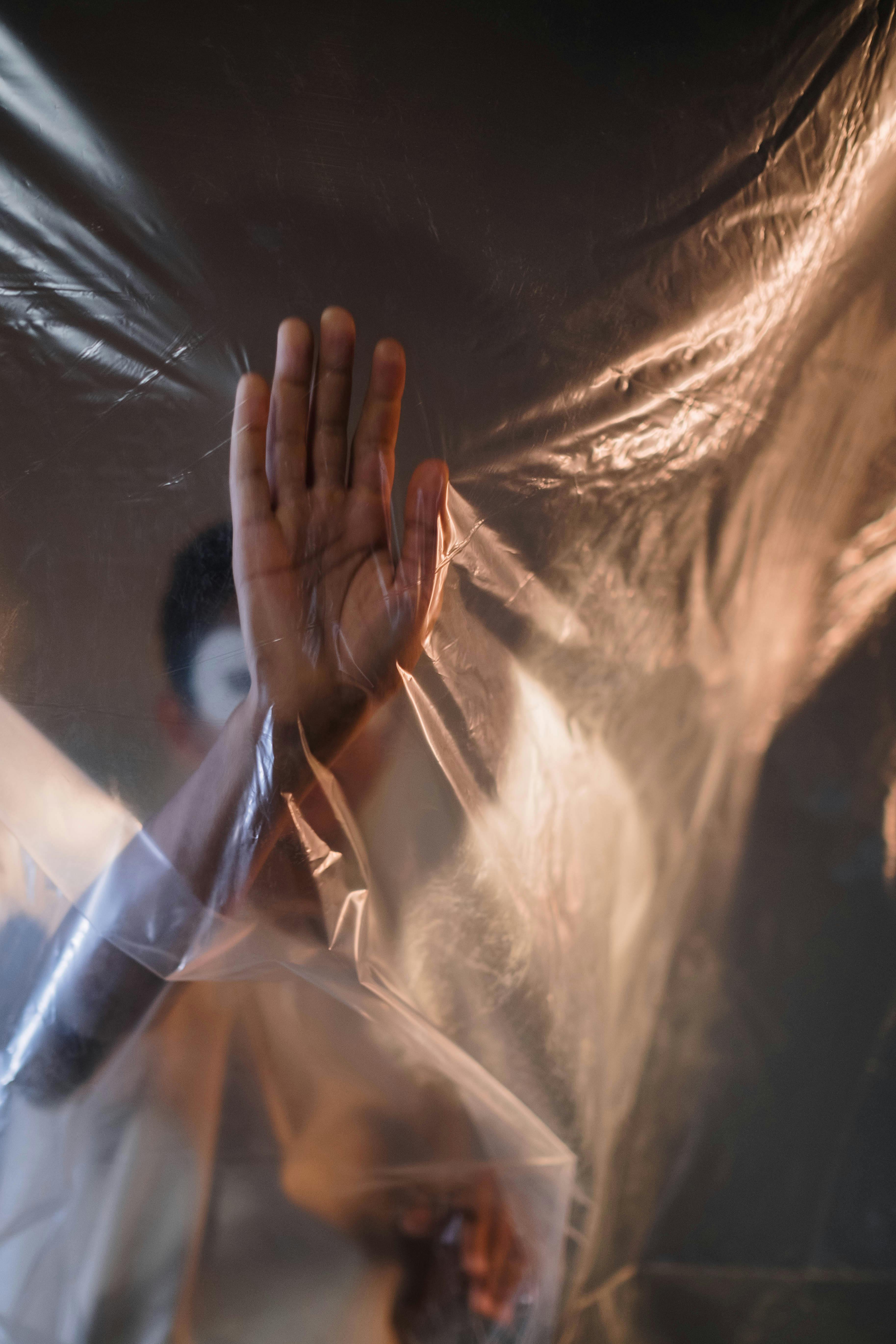 Person Touching Plastic · Free Stock Photo