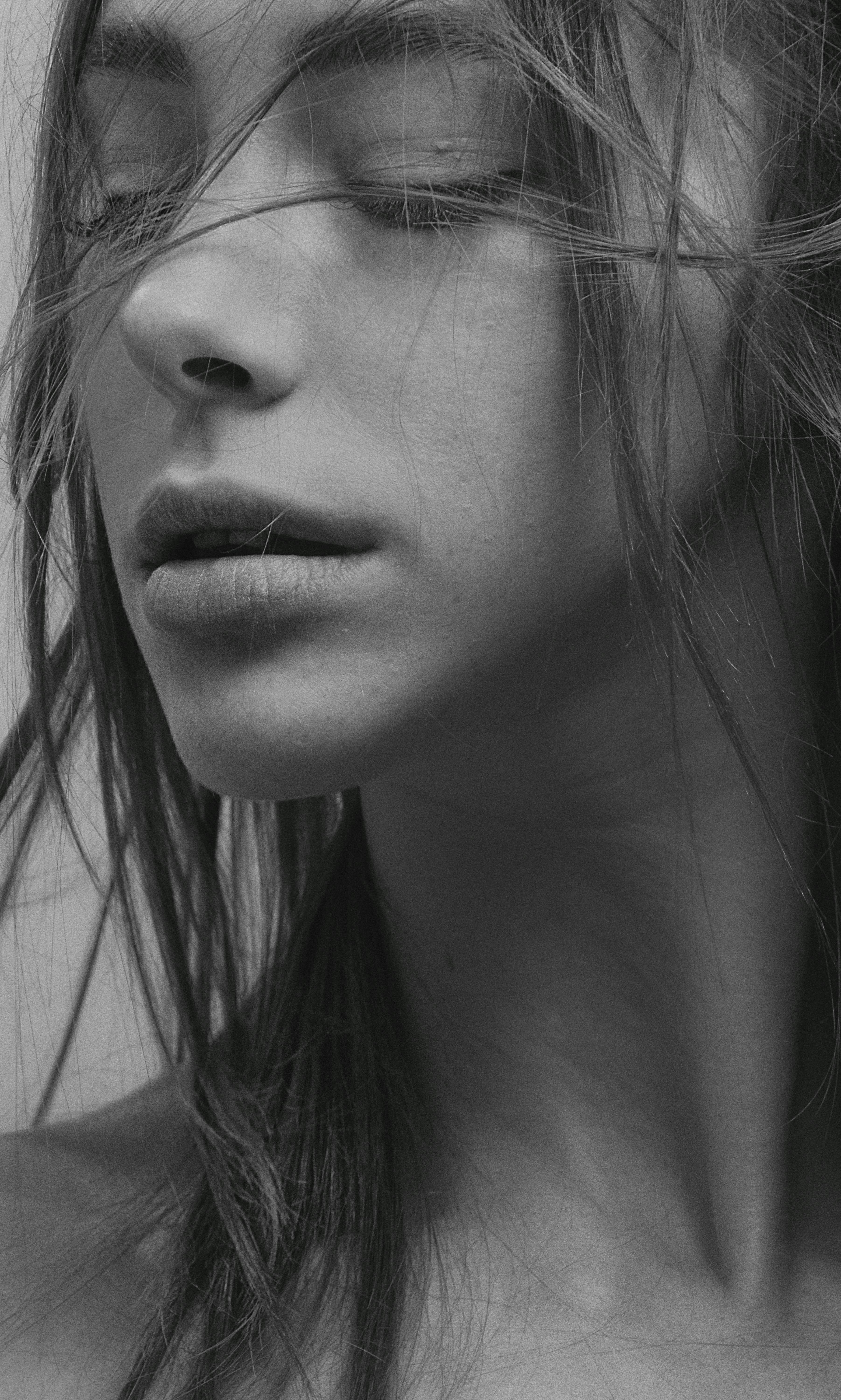 Woman Looking Sideways in Grayscale Photo · Free Stock Photo