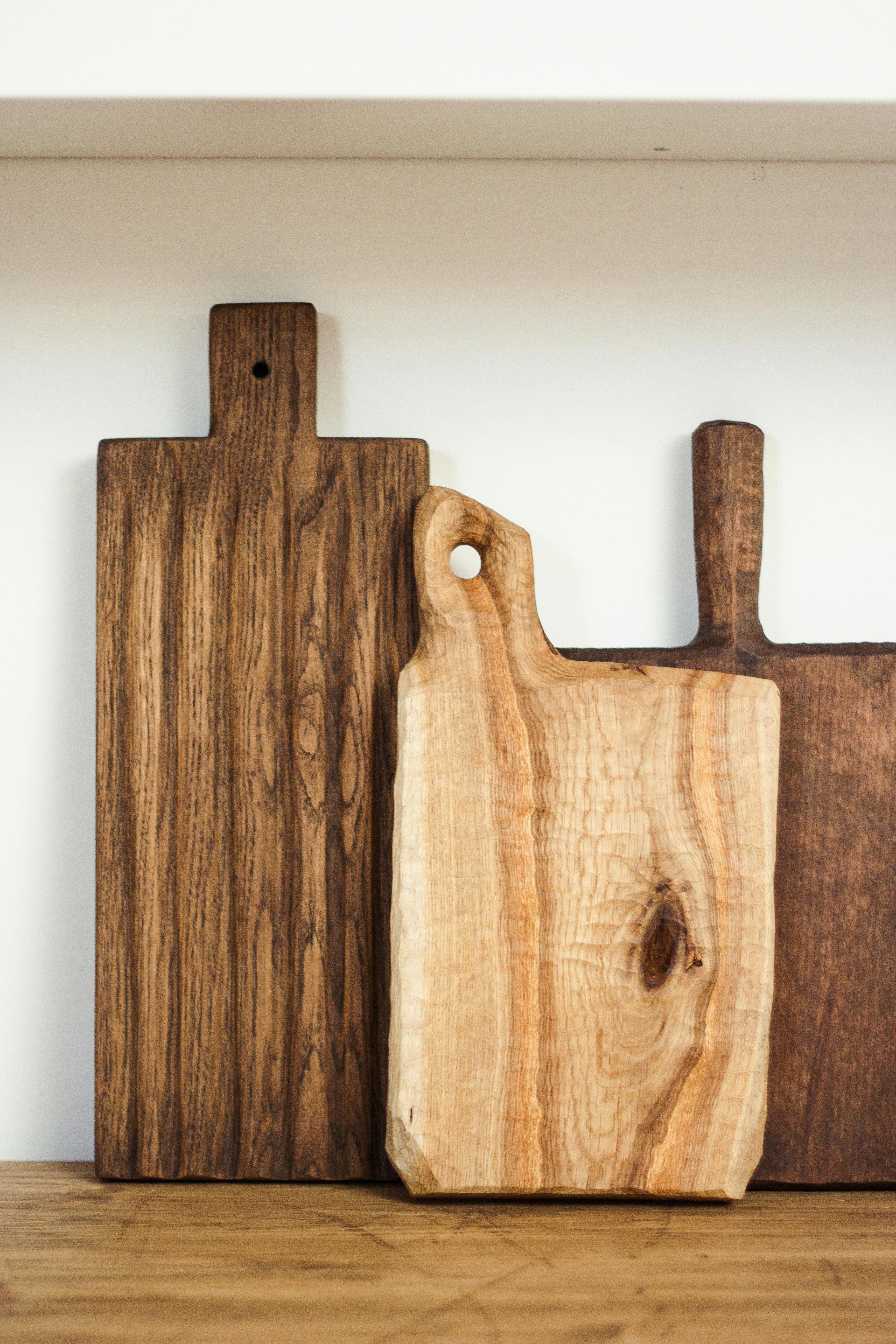 Wooden cutting boards on kitchen table · Free Stock Photo