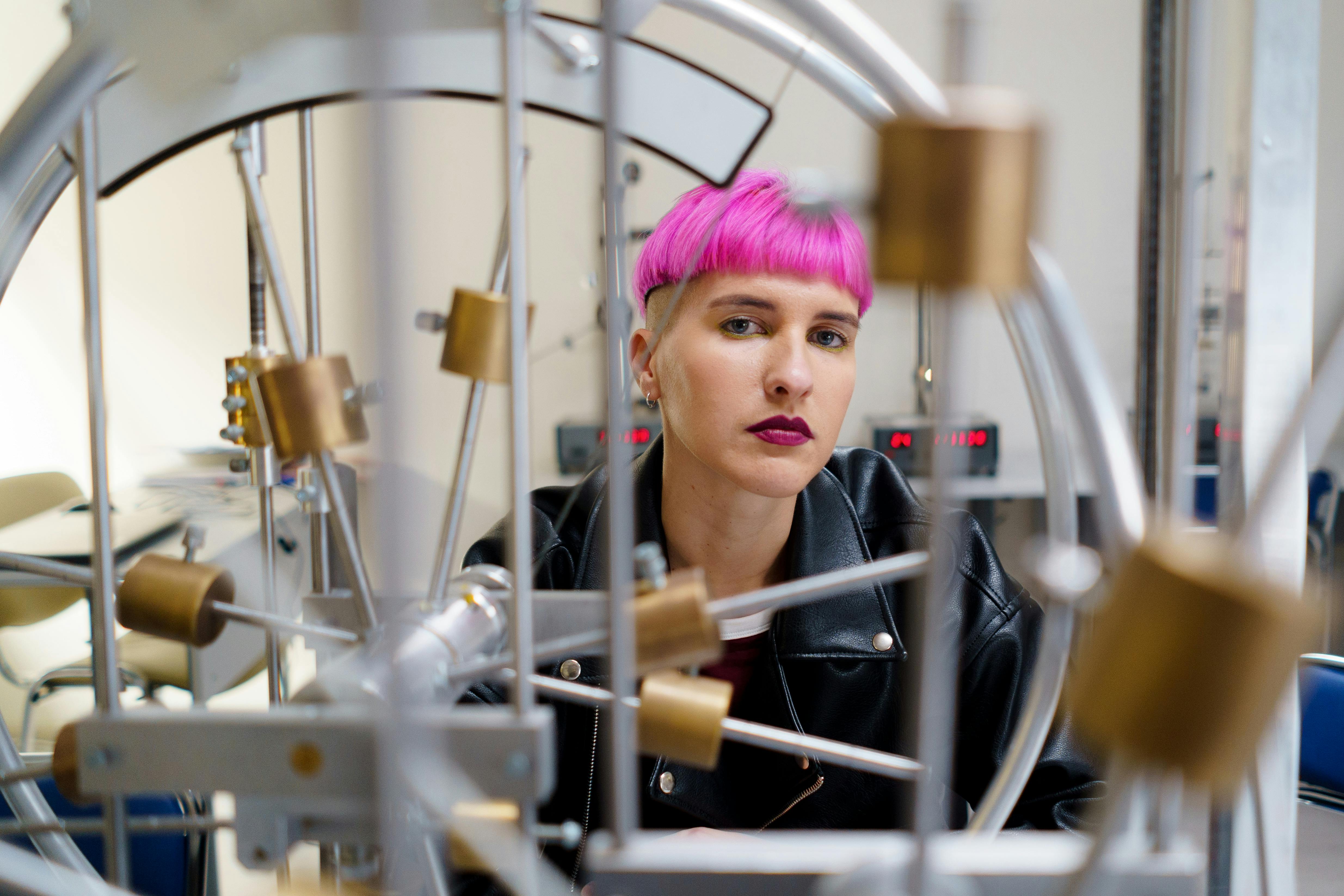Student with Pink Hair inside a Science Laboratory · Free Stock Photo