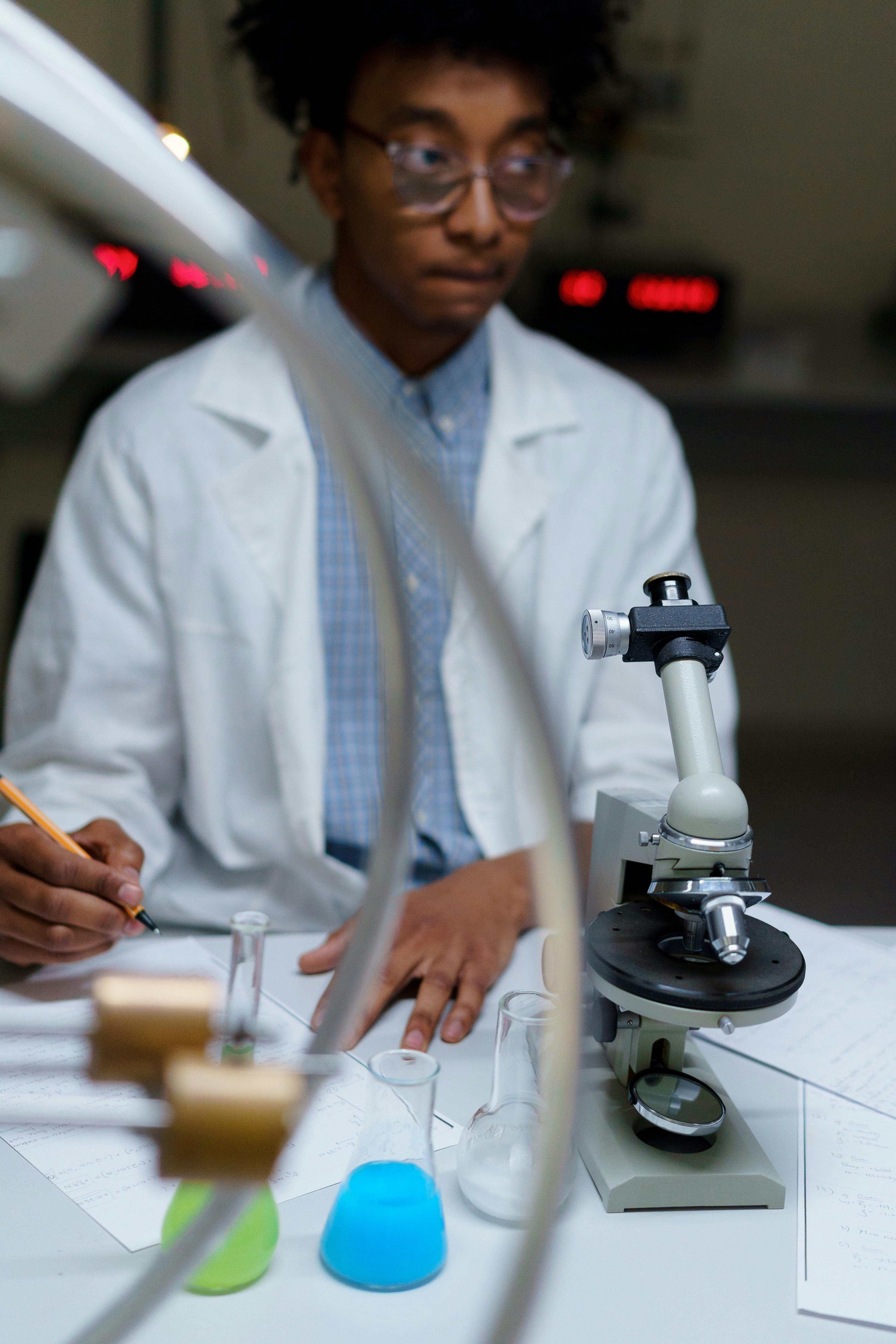 A Person Writing on a Clipboard · Free Stock Photo