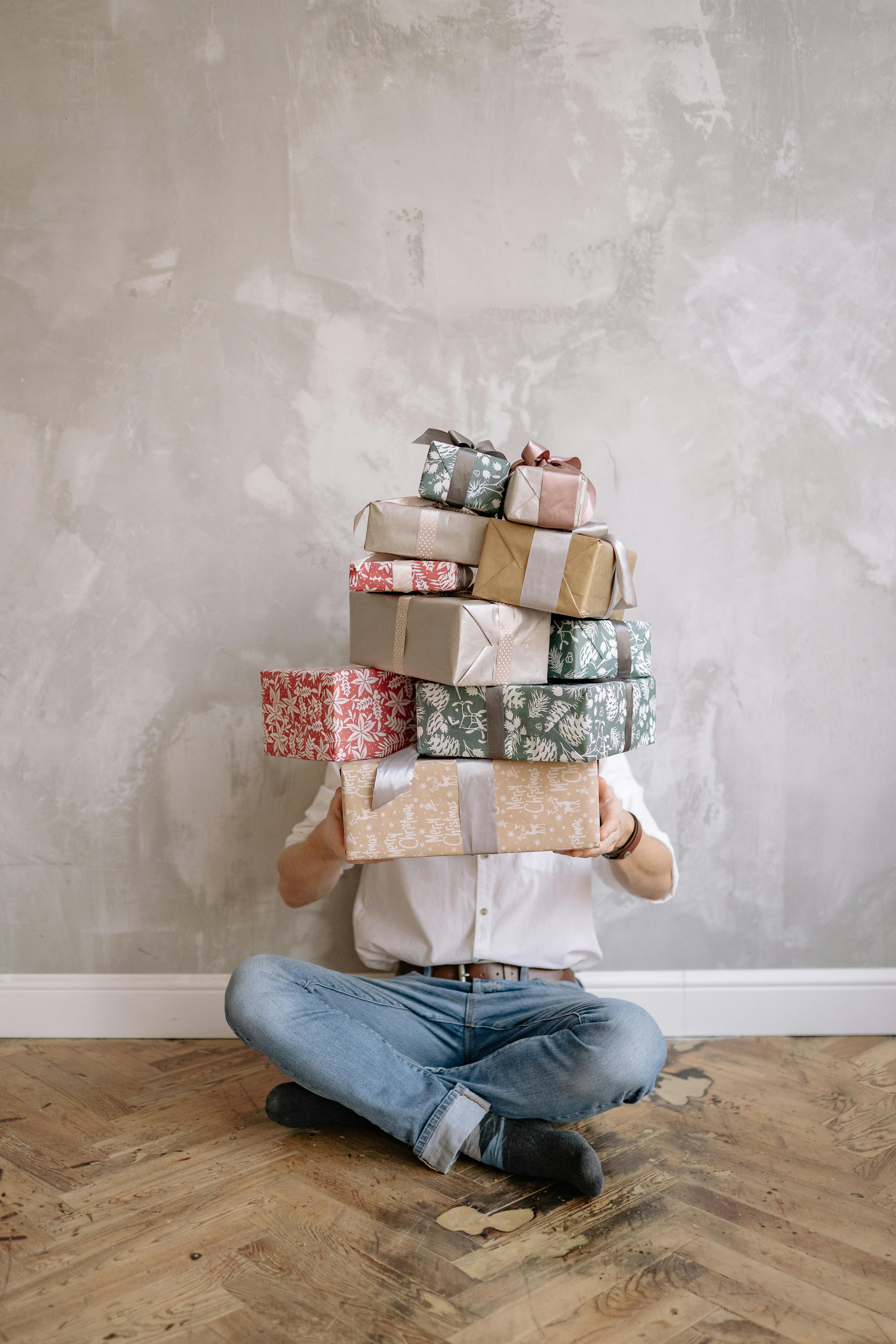 Person Carrying Gifts · Free Stock Photo