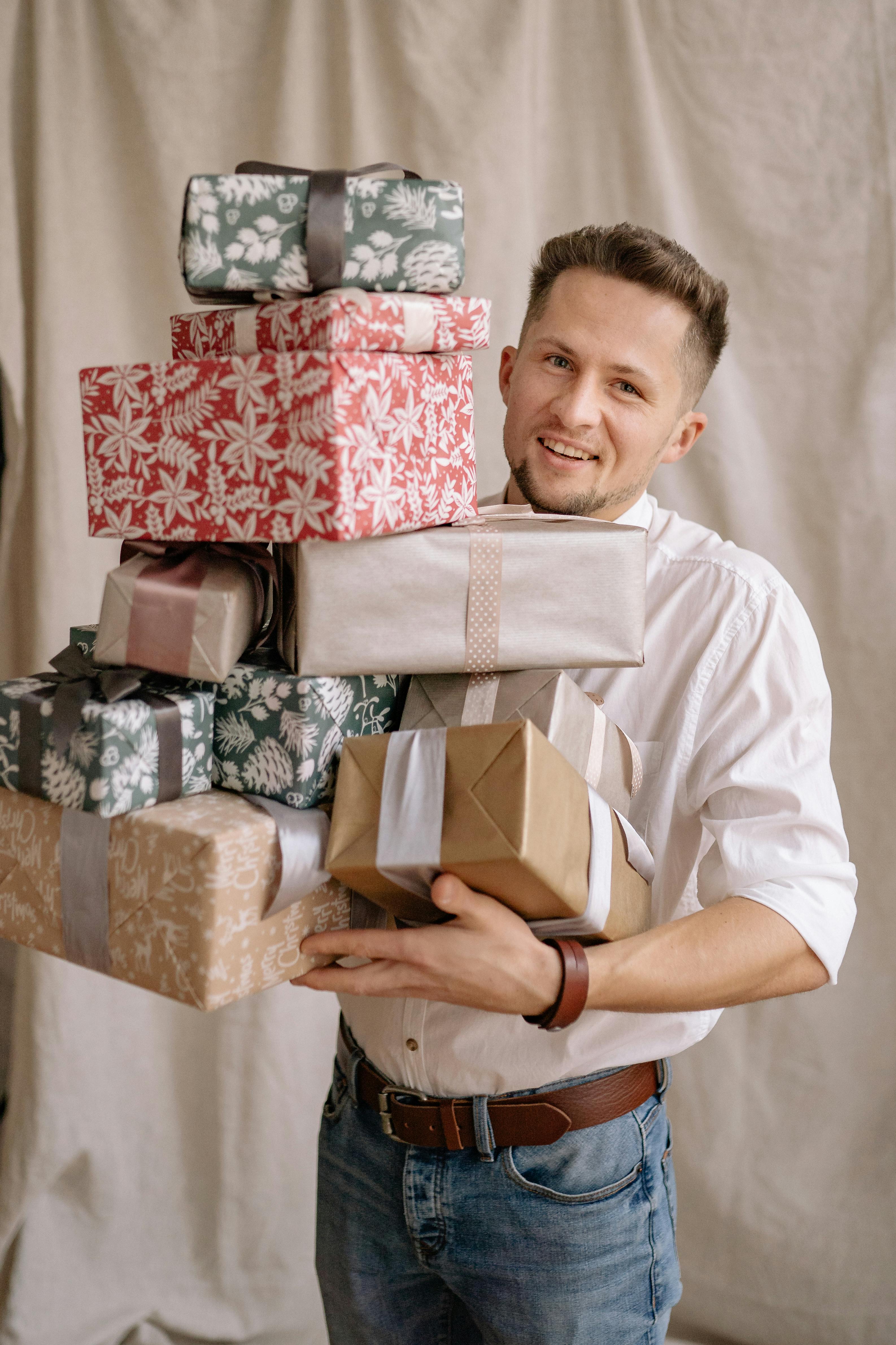 Person Carrying Gifts · Free Stock Photo