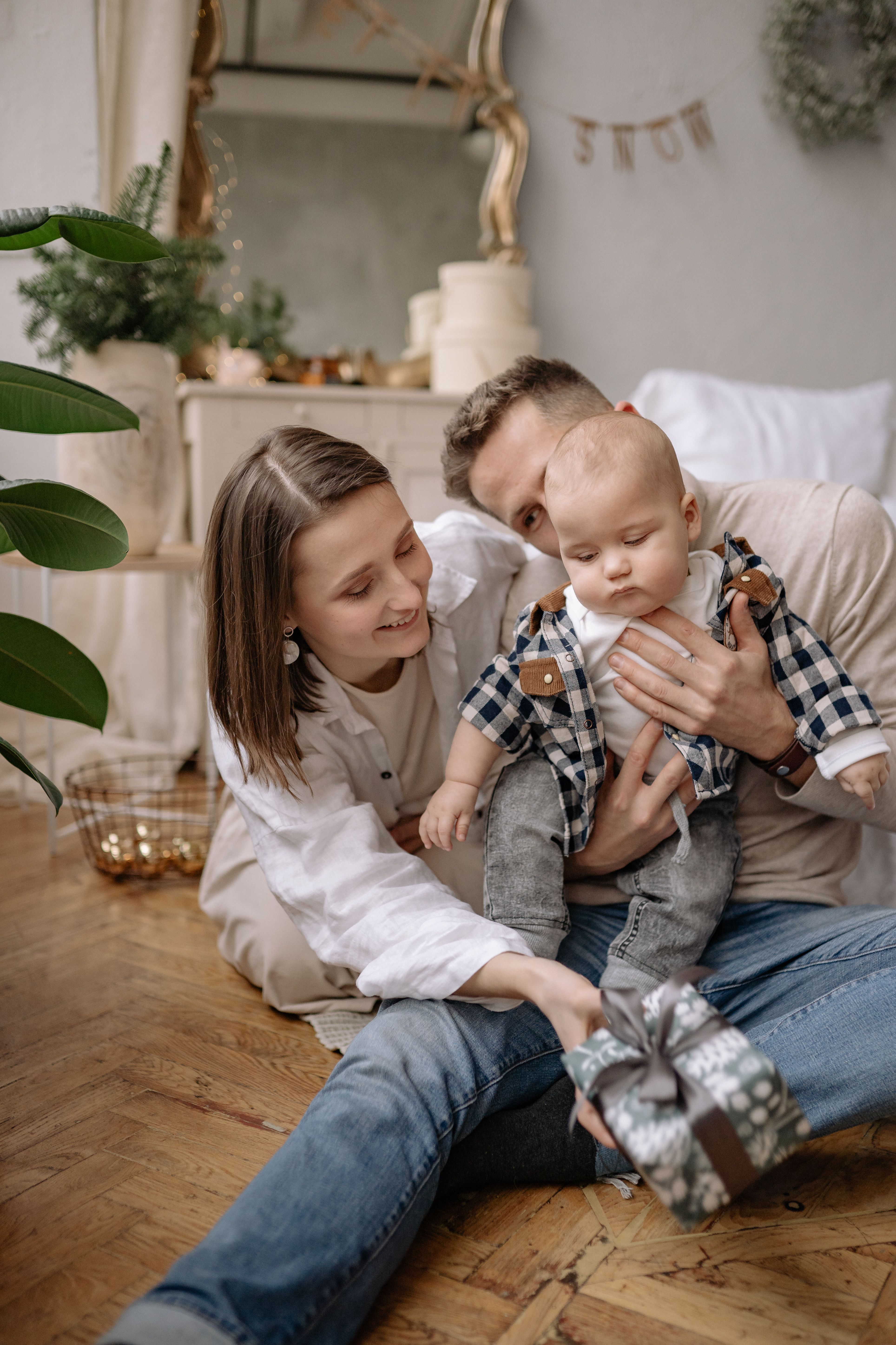 Woman Carrying Baby While Sitting Beside Little Boy · Free Stock Photo