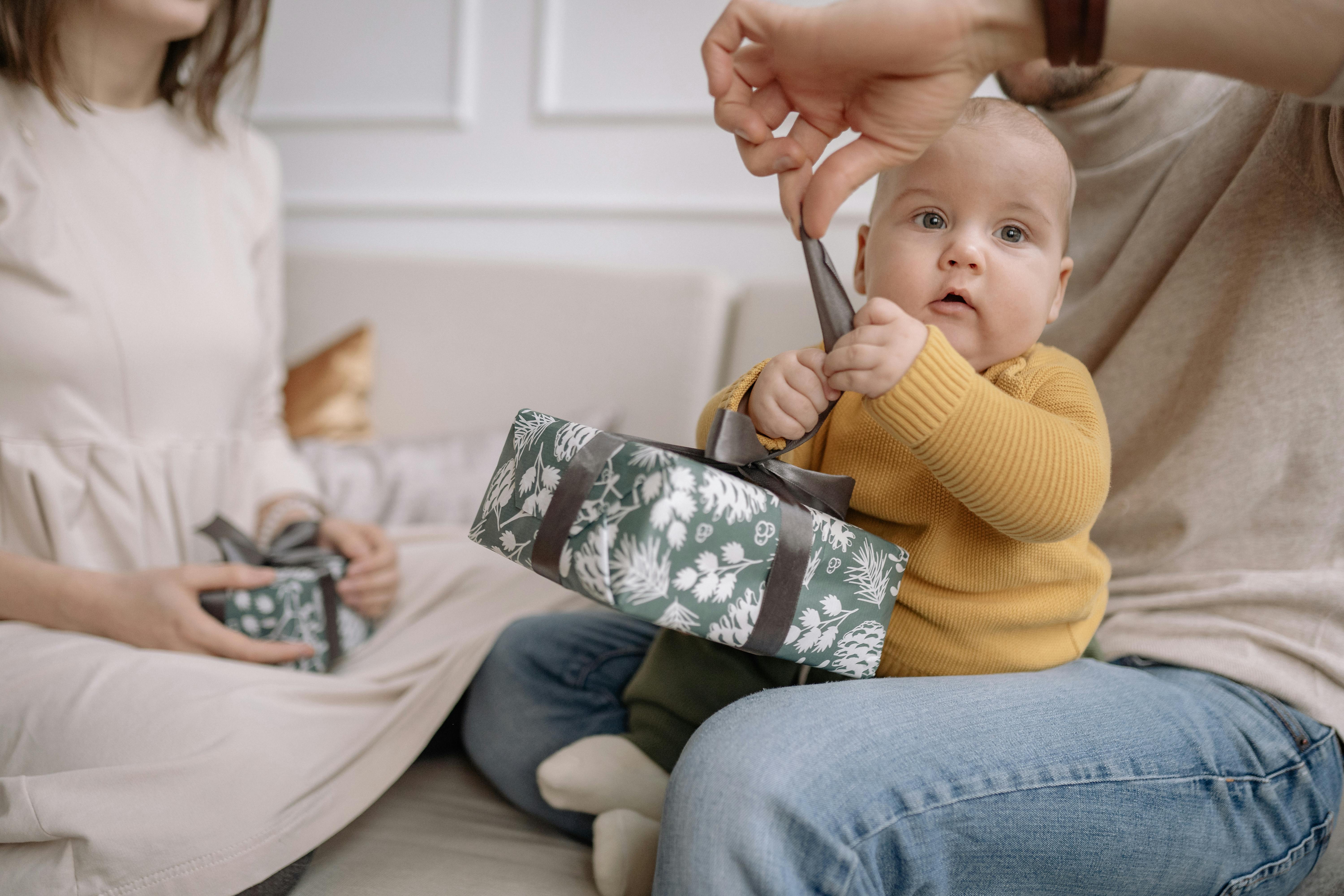 Baby with Christmas Gift · Free Stock Photo