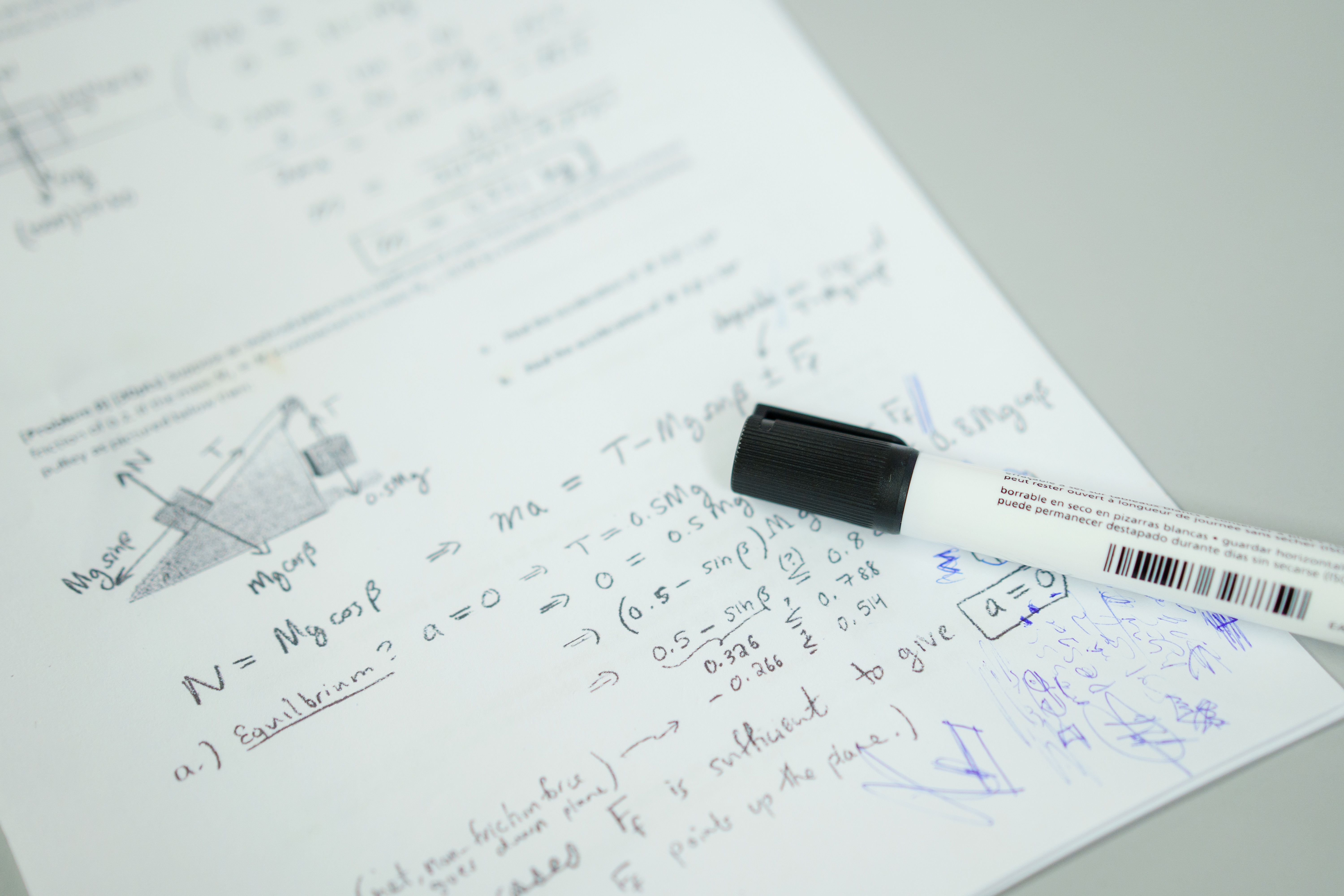Symbols Written on a Piece of Paper · Free Stock Photo