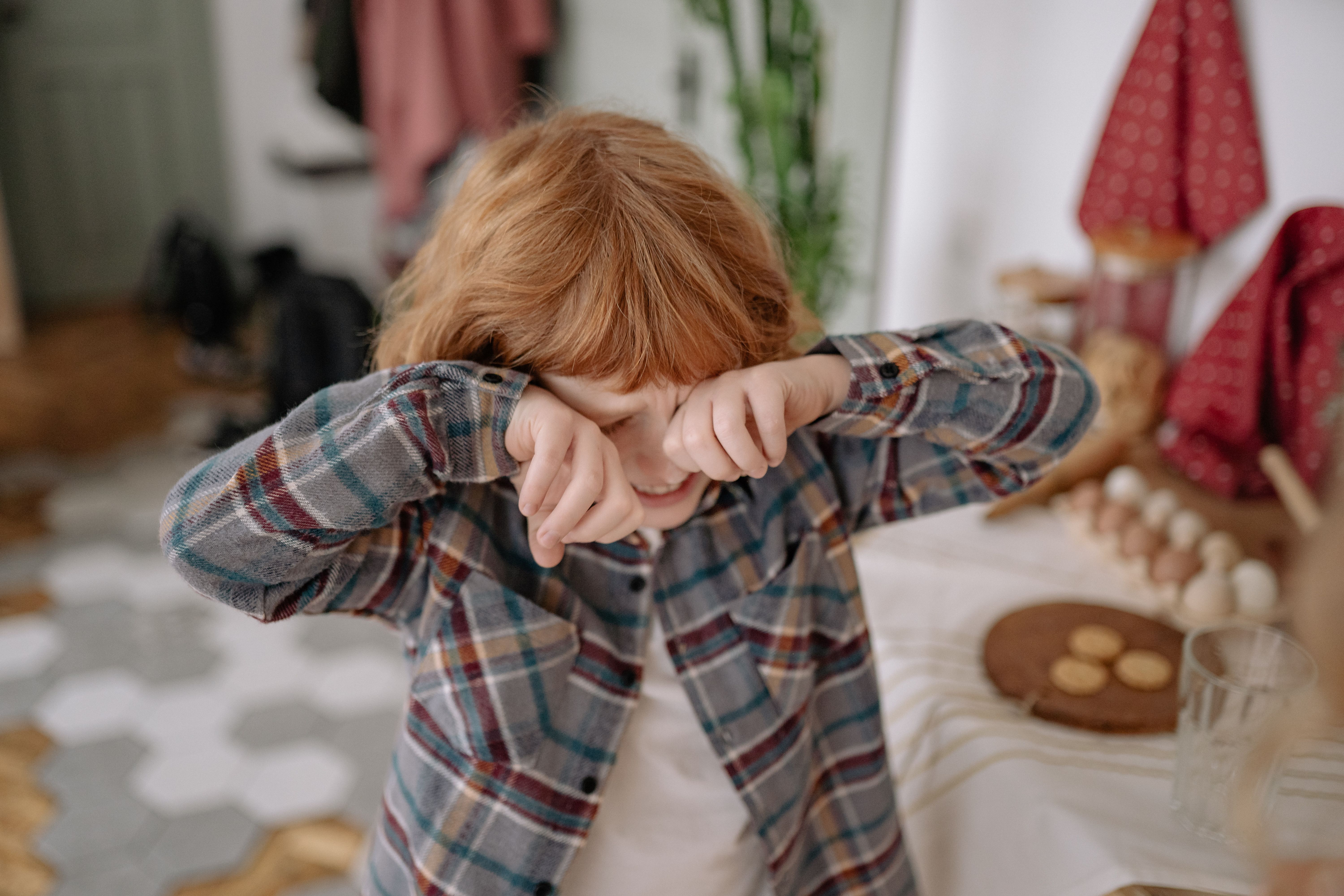 A Boy Crying while Covering Eyes · Free Stock Photo