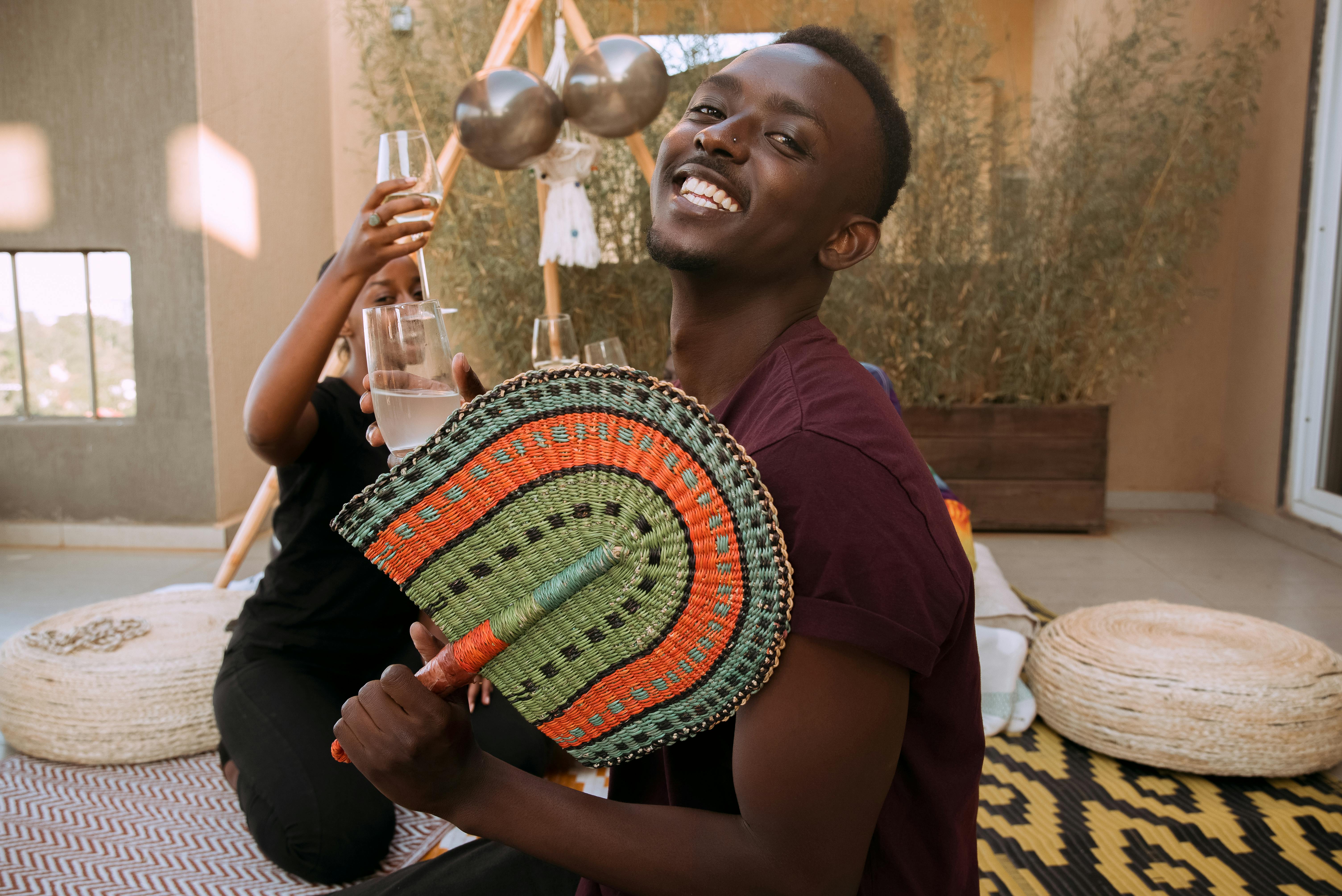 Smiling Man with Handfan · Free Stock Photo