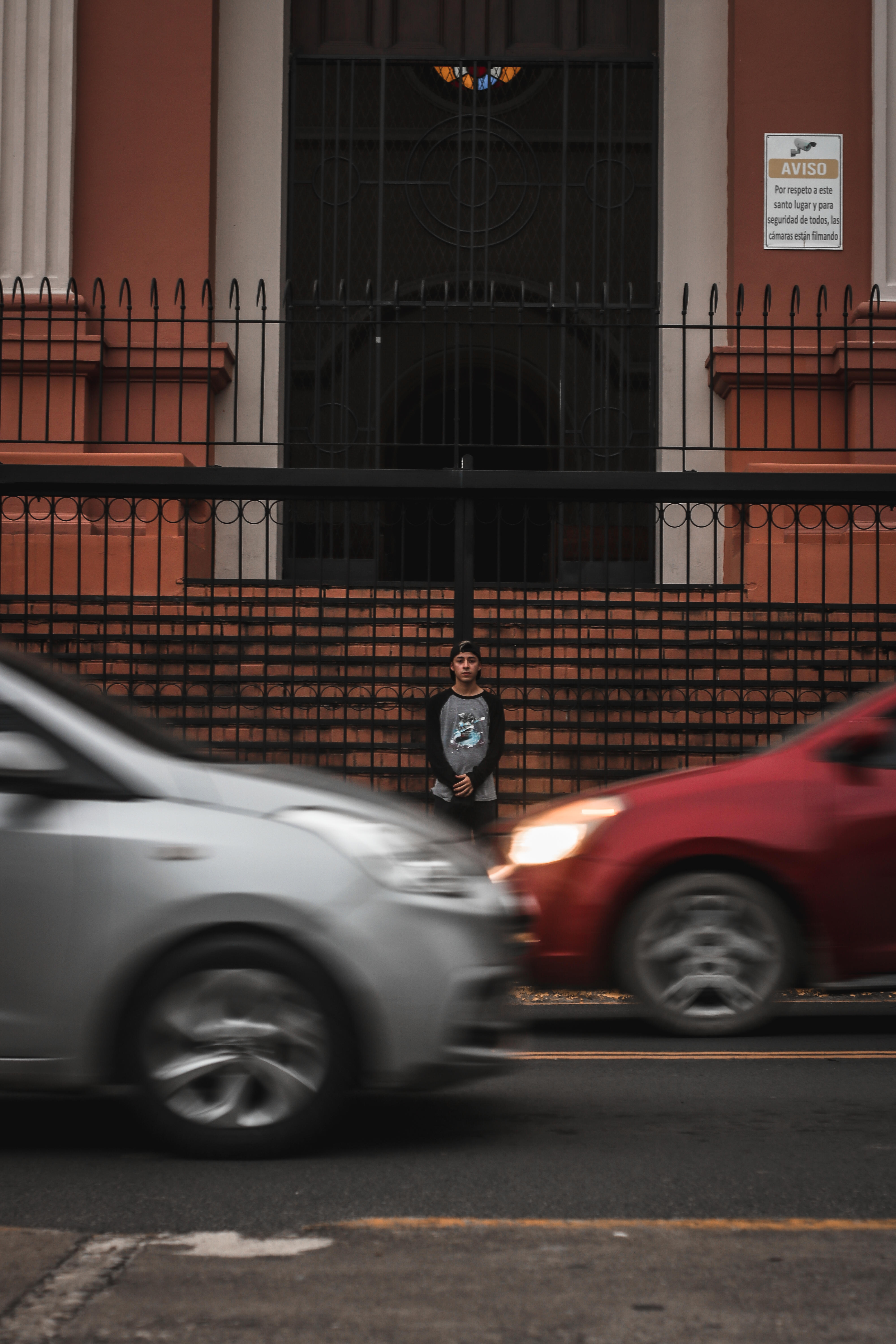 A Young Man Standing in the Street · Free Stock Photo