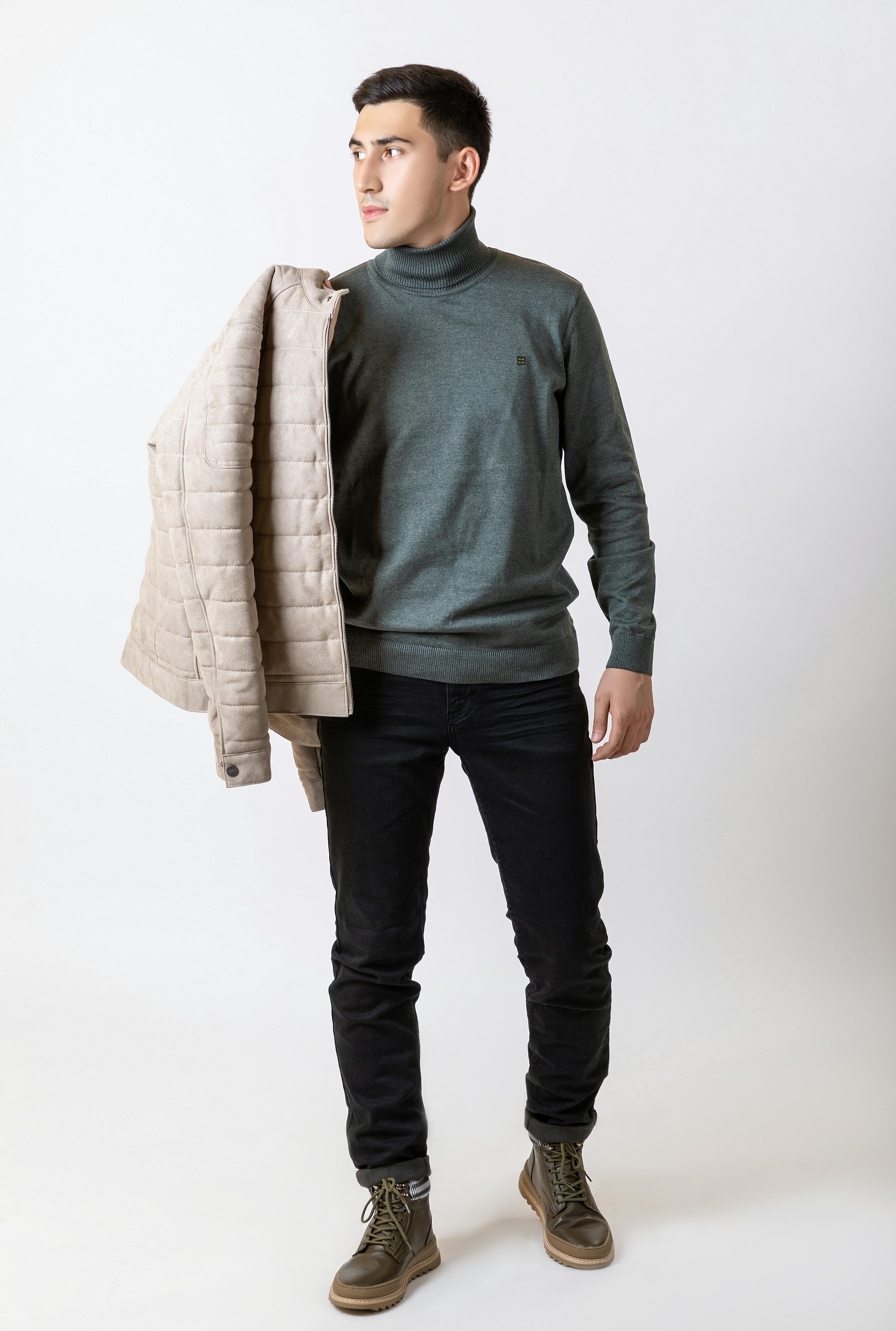 Man Posing with His Jacket Thrown Over His Shoulder · Free Stock Photo