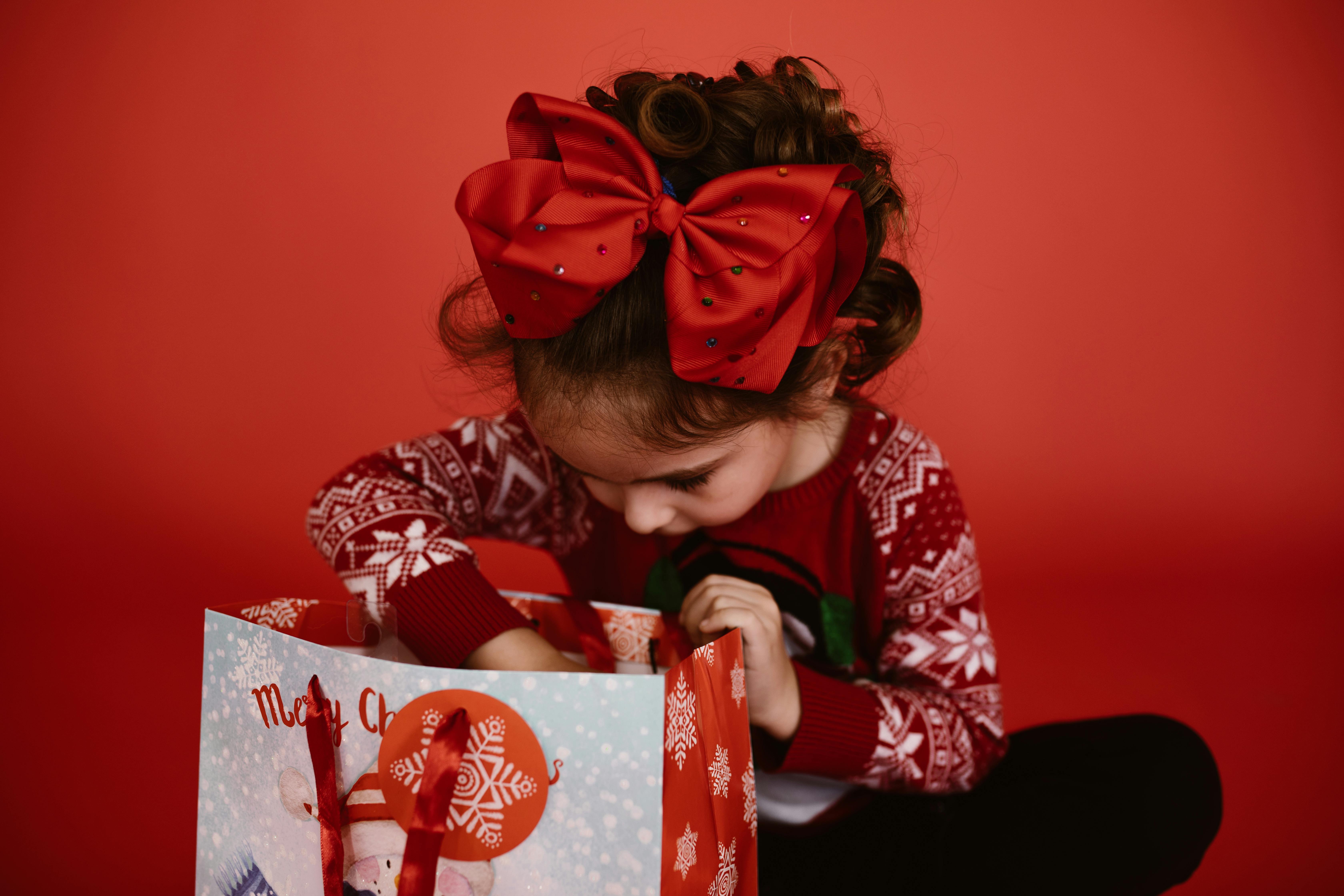 Close Up Photo of Girl Looking Inside the Paper Bag · Free Stock Photo