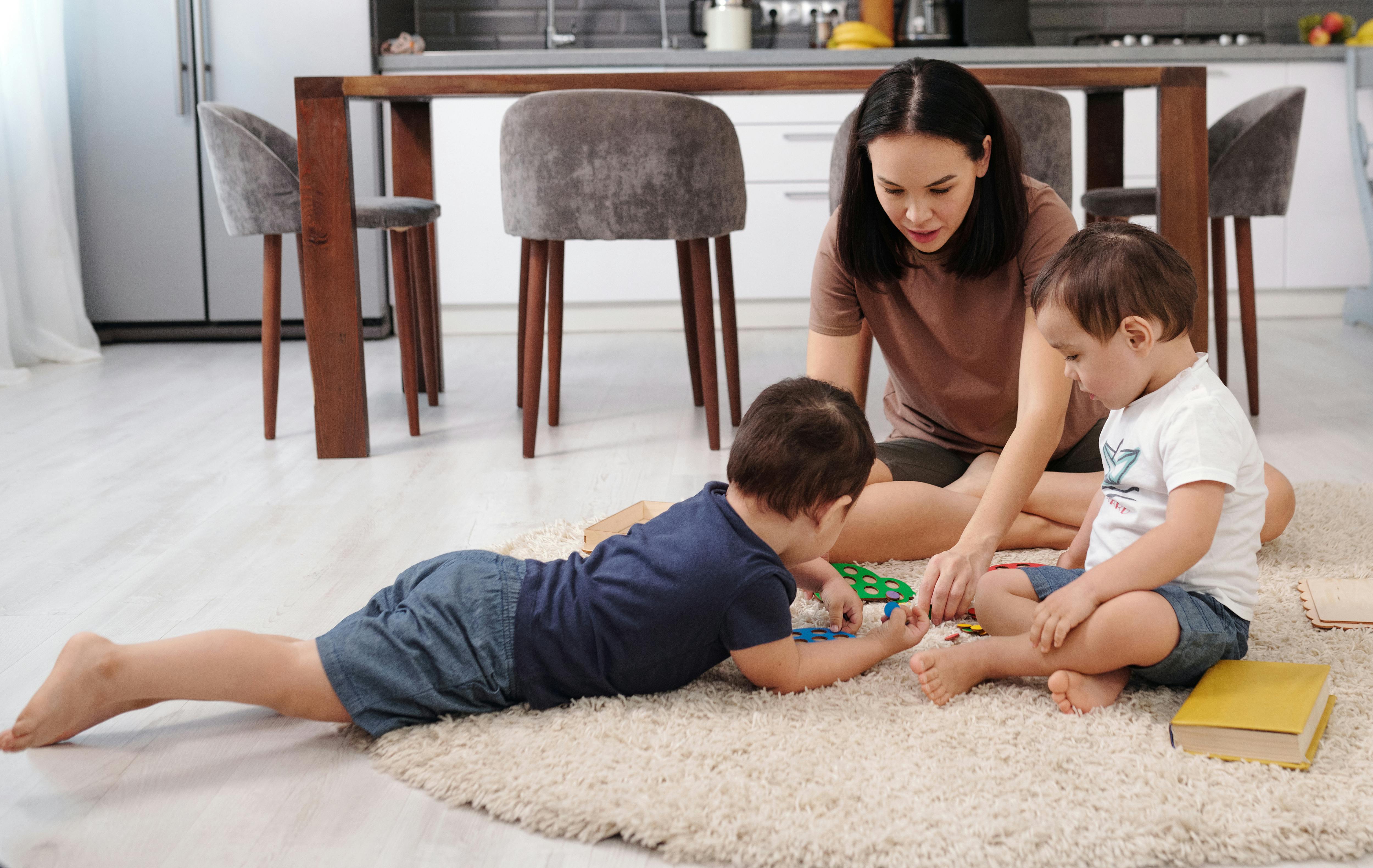 A Woman Playing with Children · Free Stock Photo