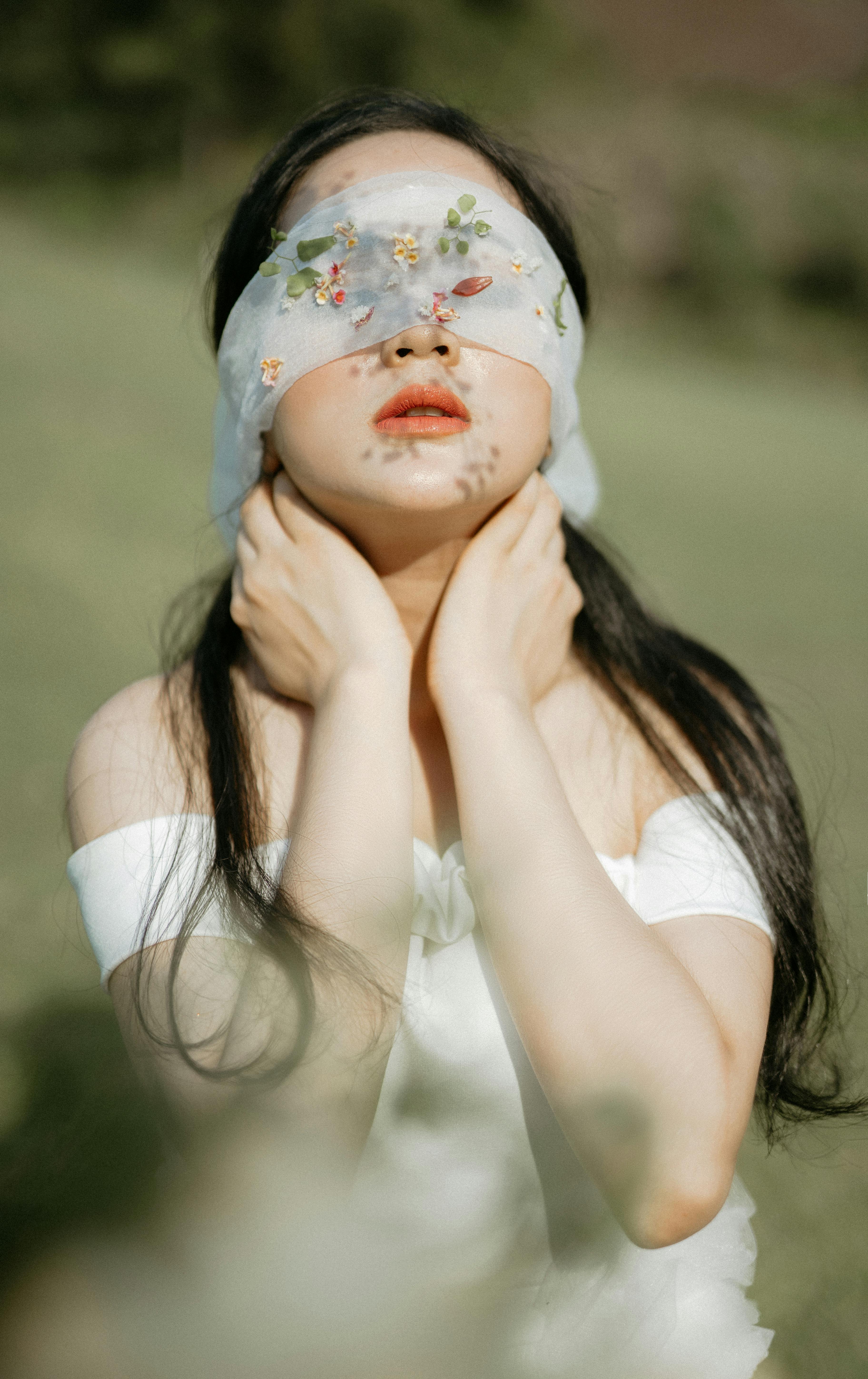Faceless ethnic woman covering eyes with veil in countryside · Free ...