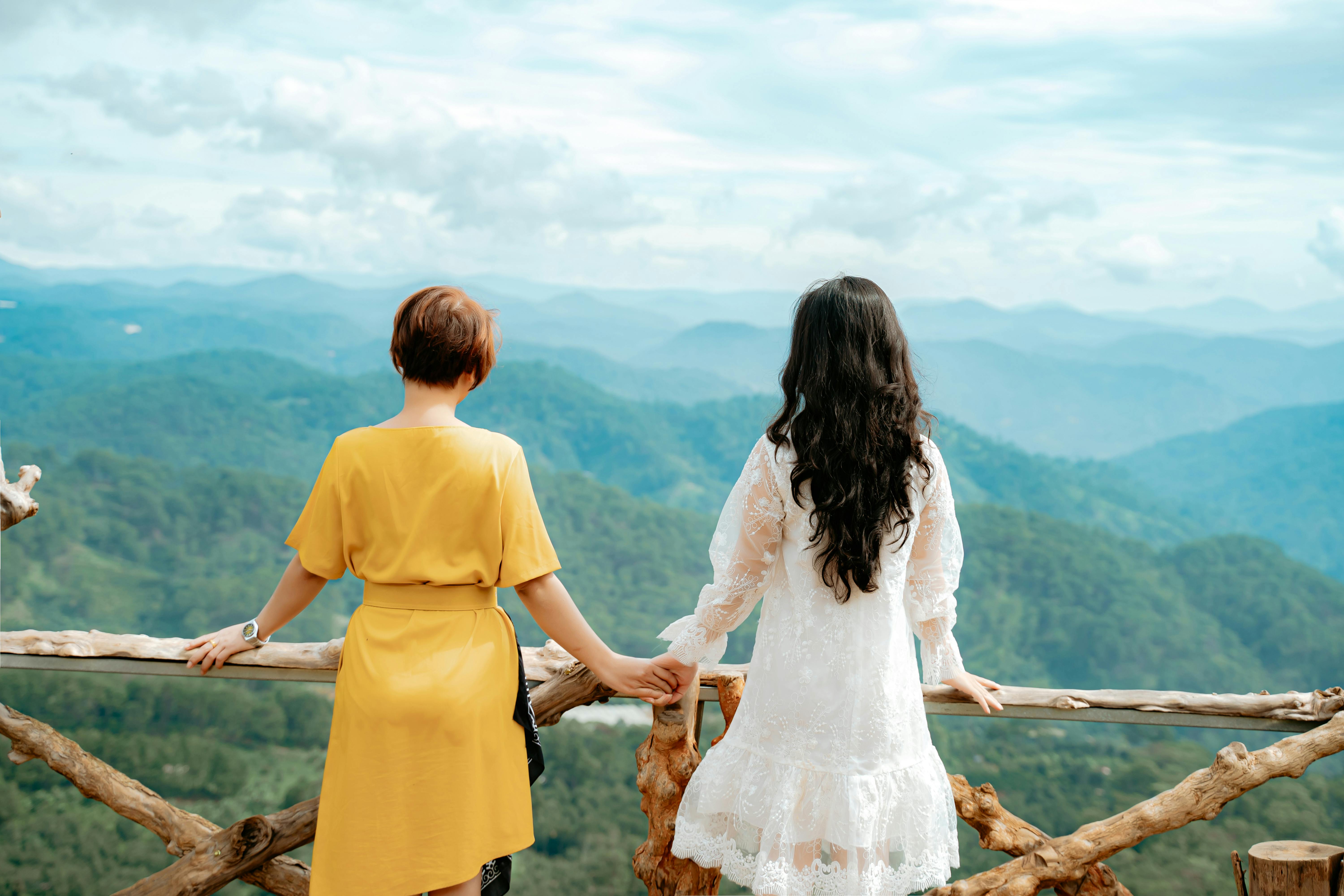 Faceless travelers enjoying ridges in fog under cloudy sky · Free Stock ...