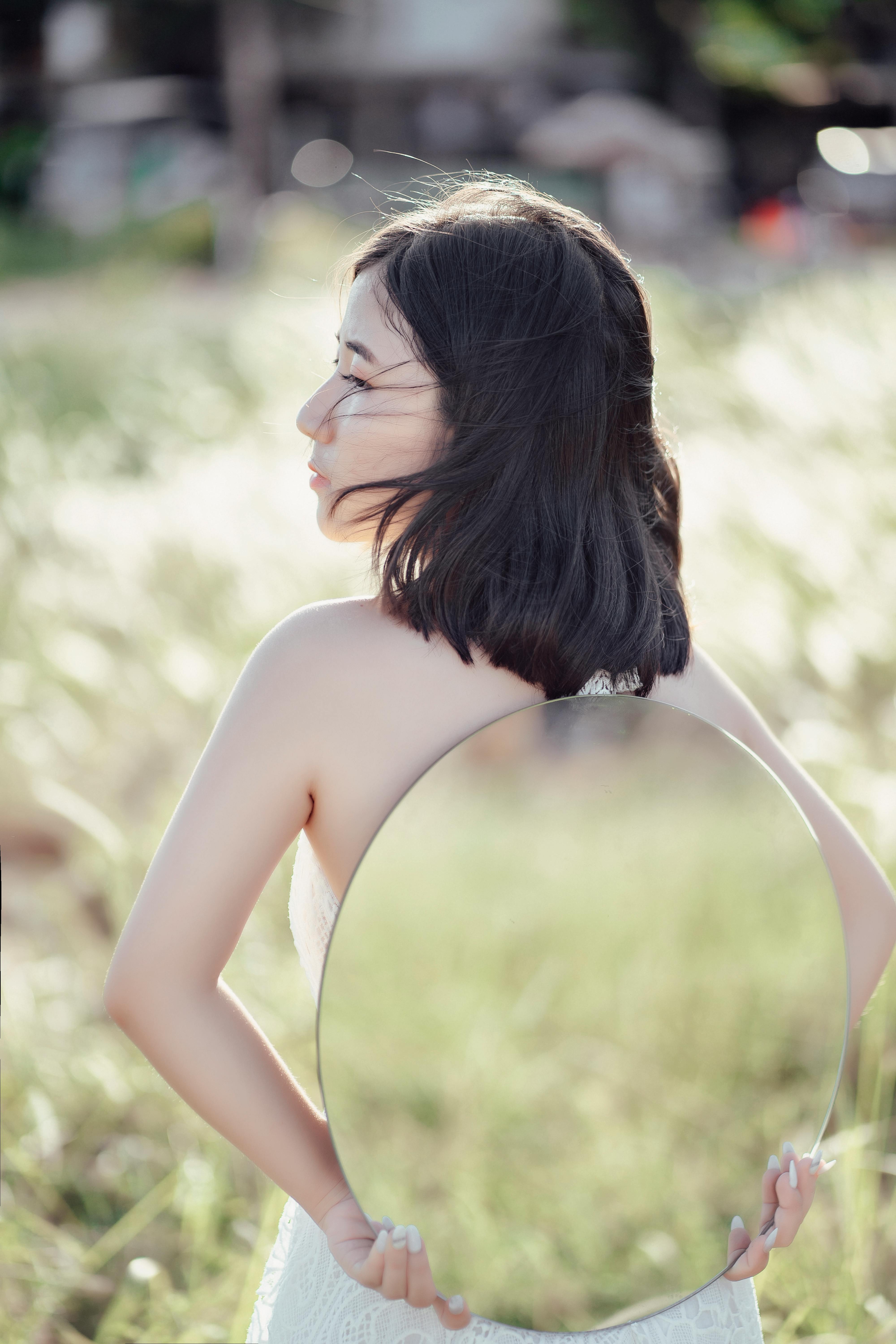 Faceless woman with bull skull in countryside · Free Stock Photo