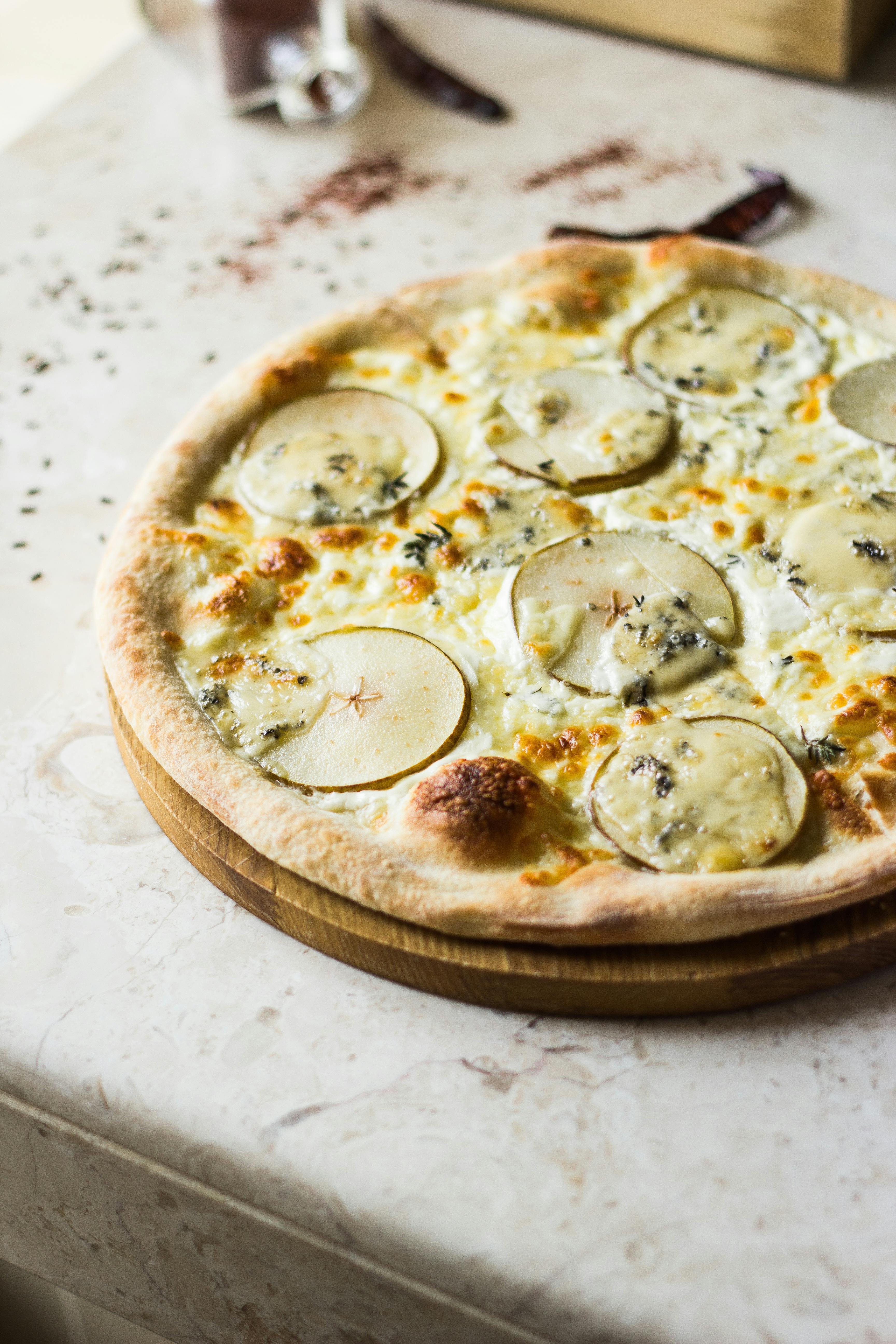 A Person Eating Pizza on the Bed · Free Stock Photo
