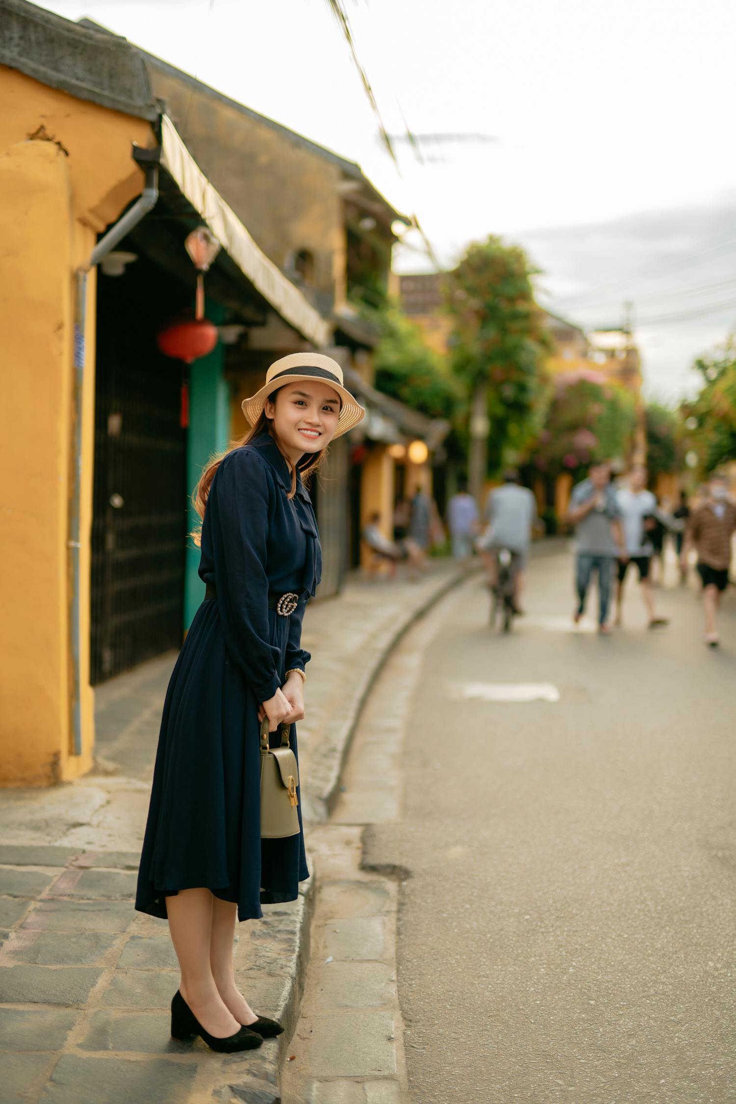 Smiling elegant Asian tourist on city street · Free Stock Photo Smiling elegant Asian tourist on city street · Free Stock Photo