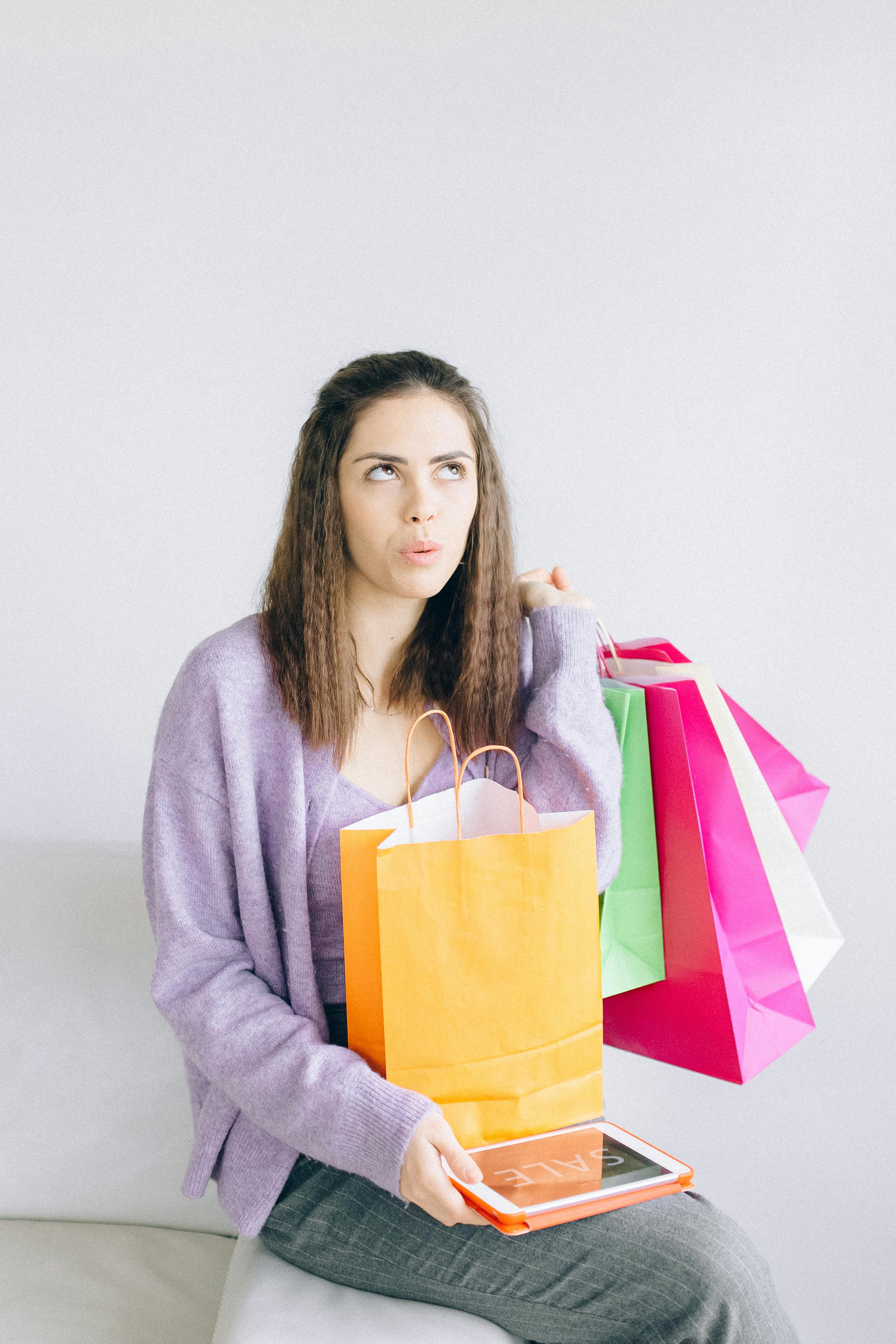 A Woman Looking inside a Paper Bag · Free Stock Photo