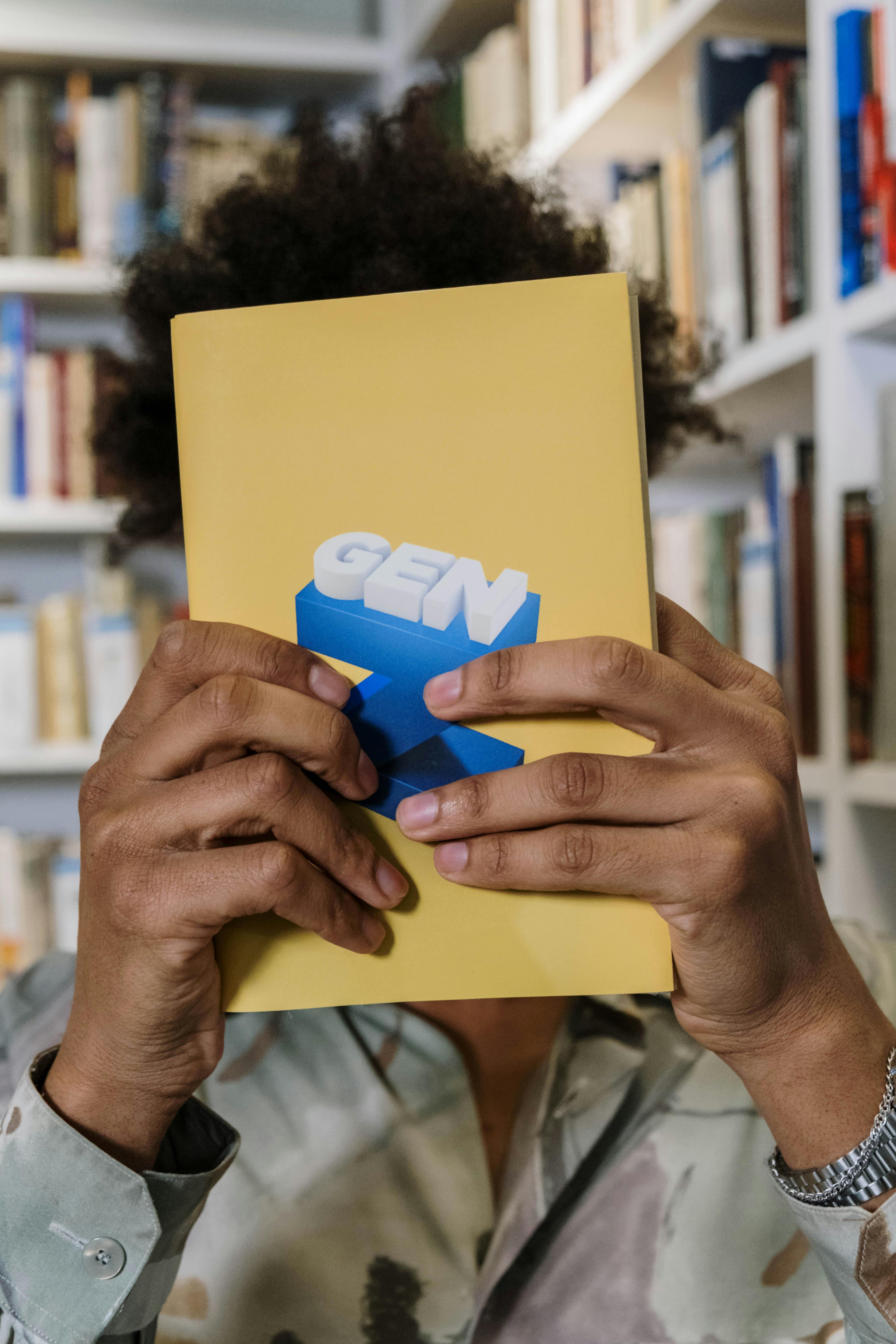 Close-up Photo of Yellow Book held by a Person · Free Stock Photo