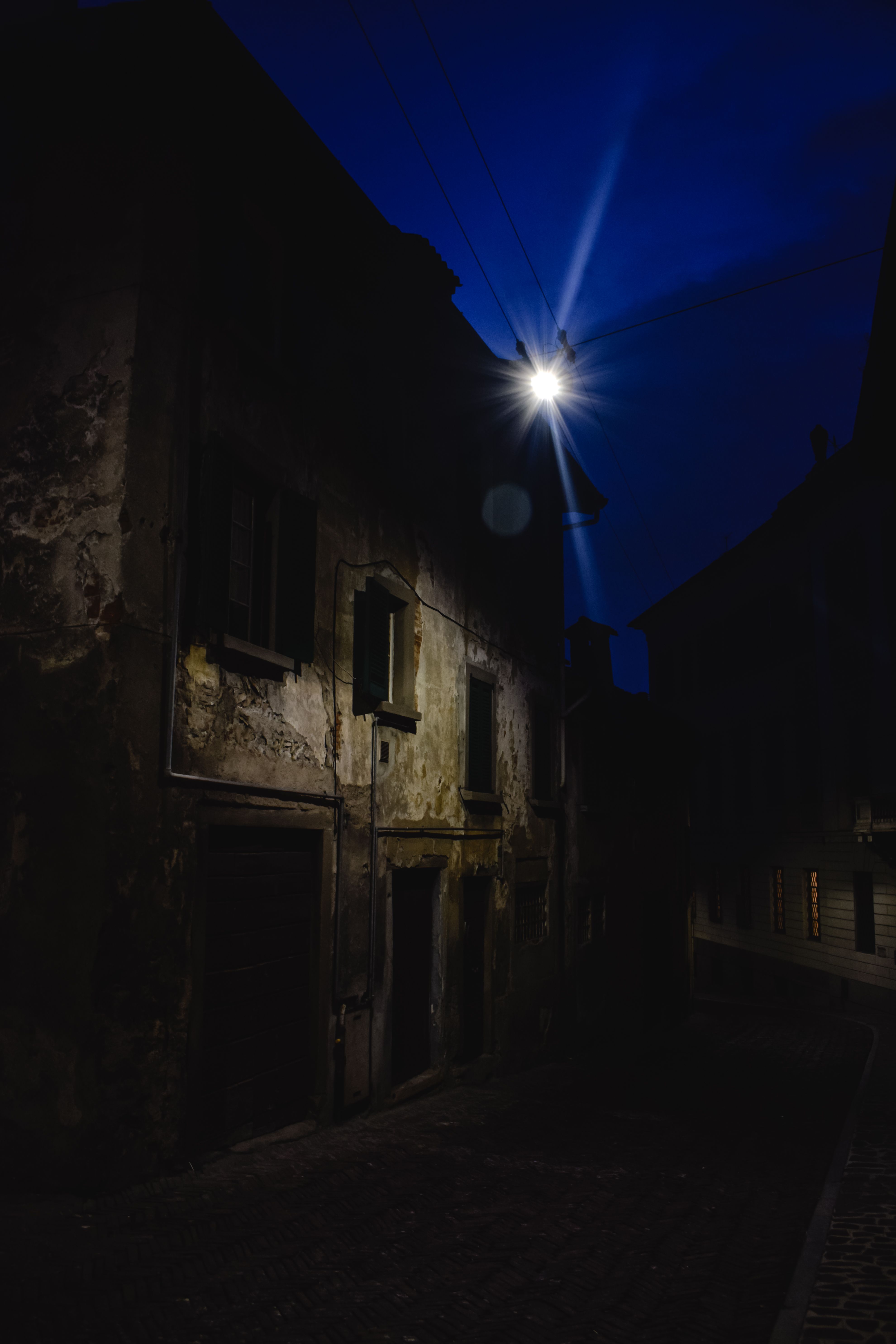 A Concrete Building at Night · Free Stock Photo