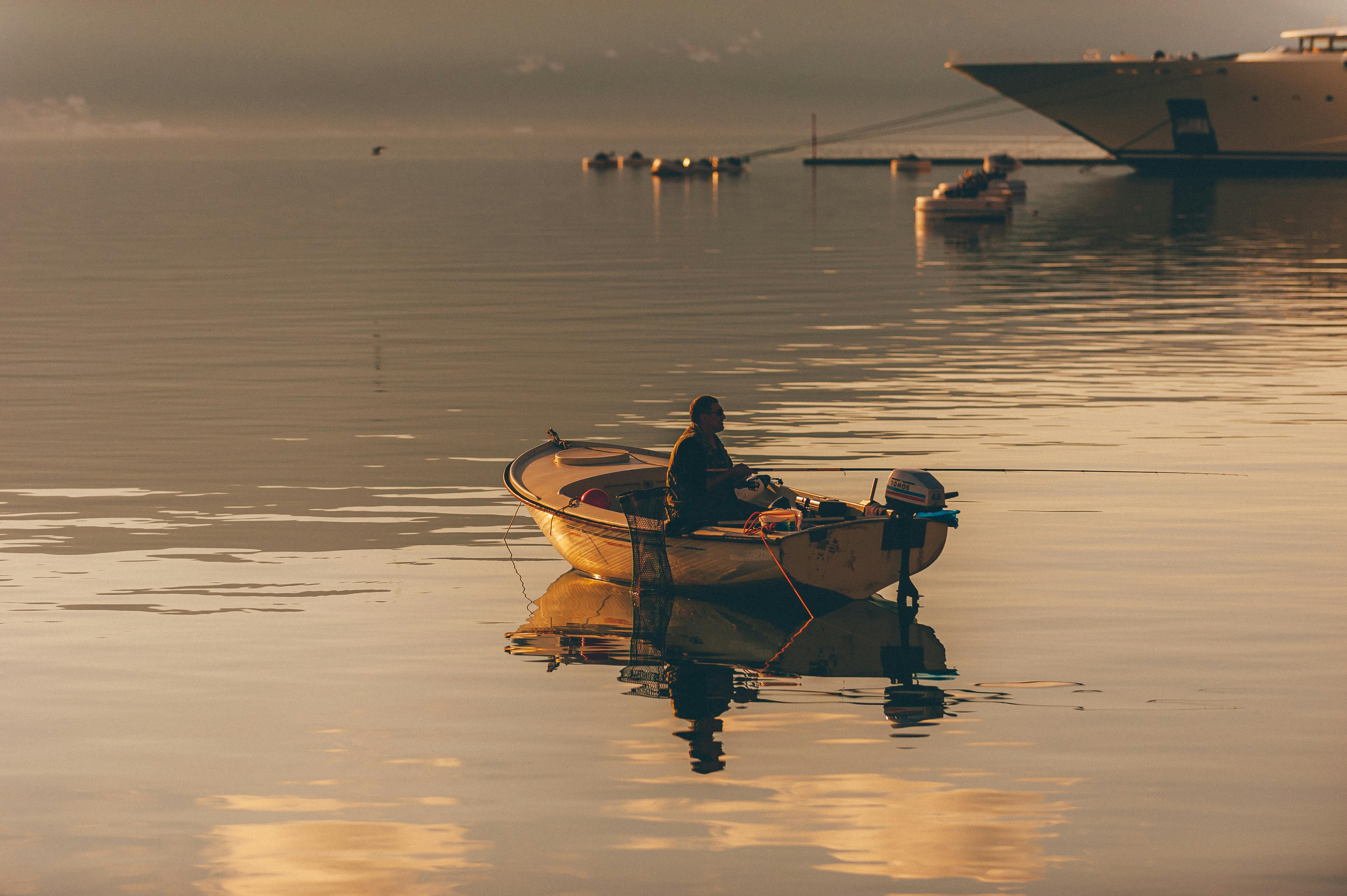 A Man Riding a Boat · Free Stock Photo