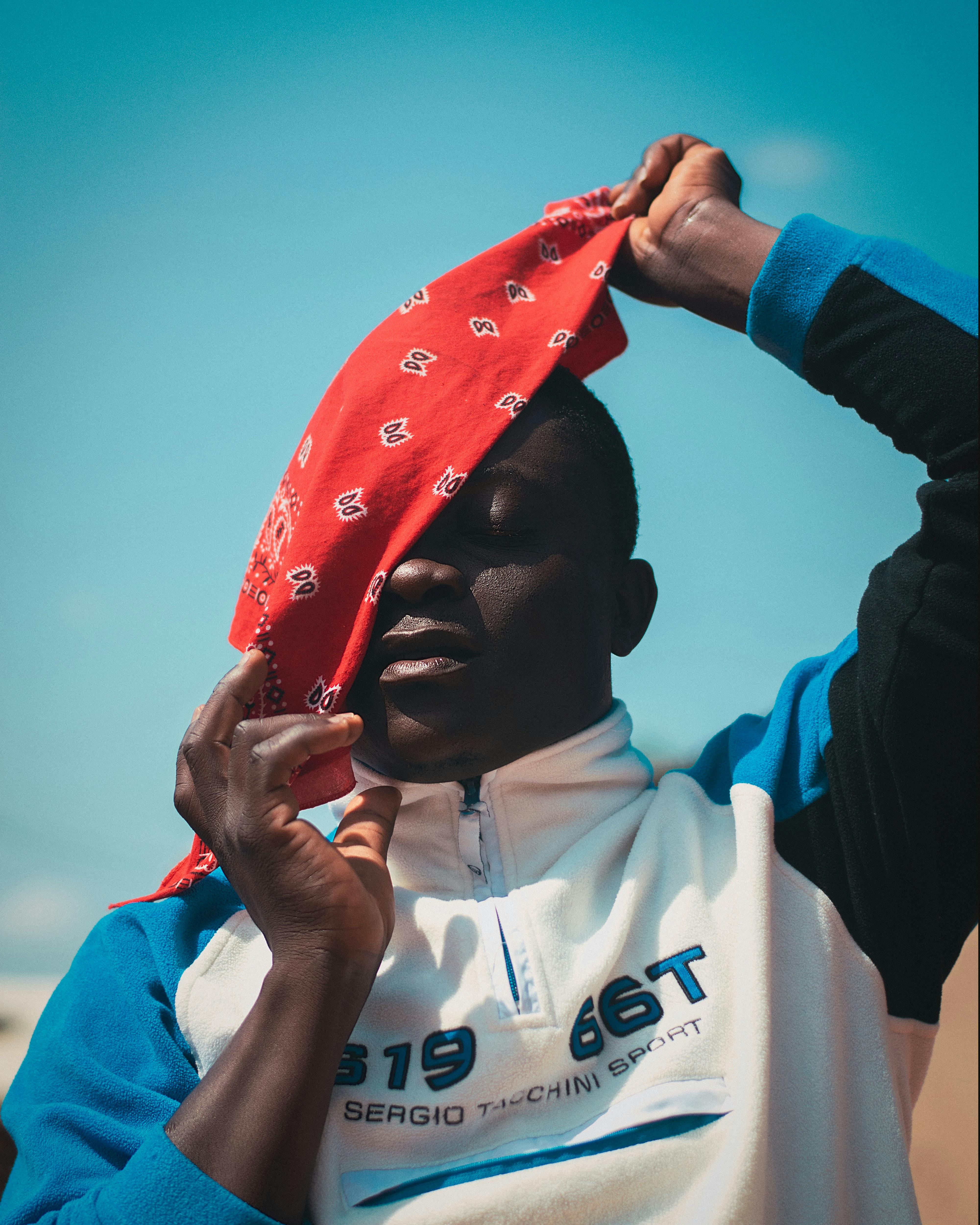Man Covering His Face with a Handkerchief · Free Stock Photo