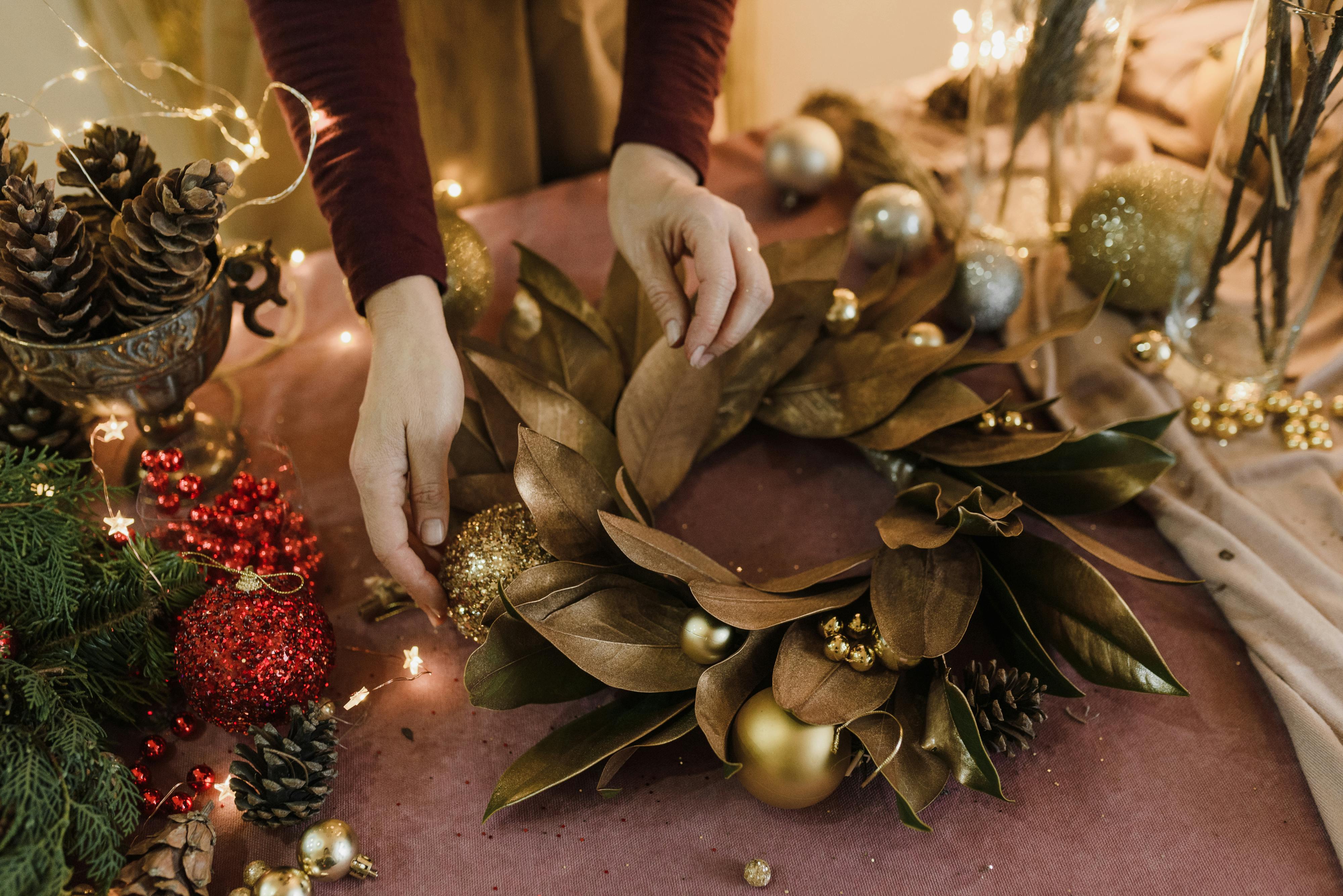 Person Arranging Christmas Decorations · Free Stock Photo