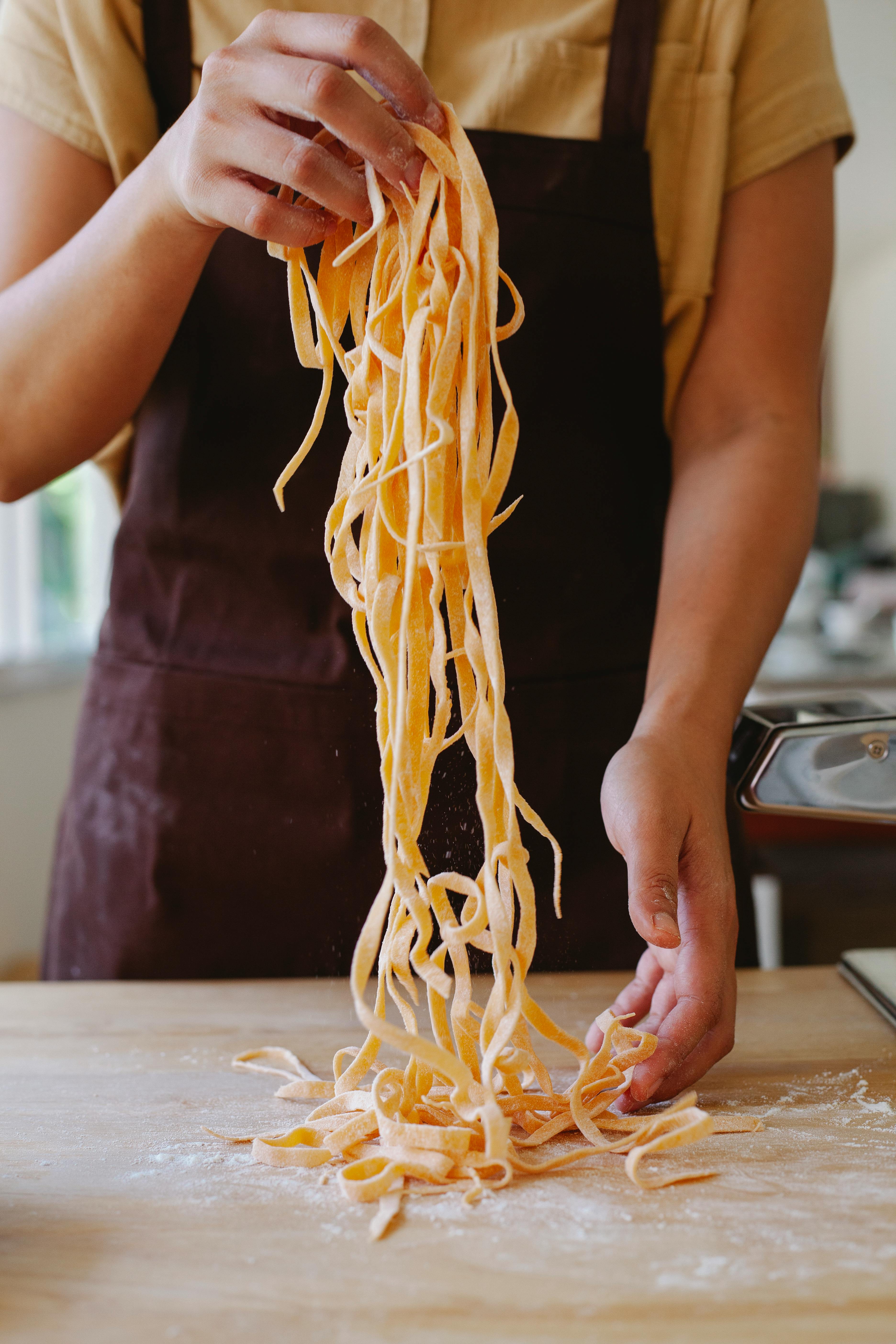 Person Making Pasta Tagliatelle · Free Stock Photo