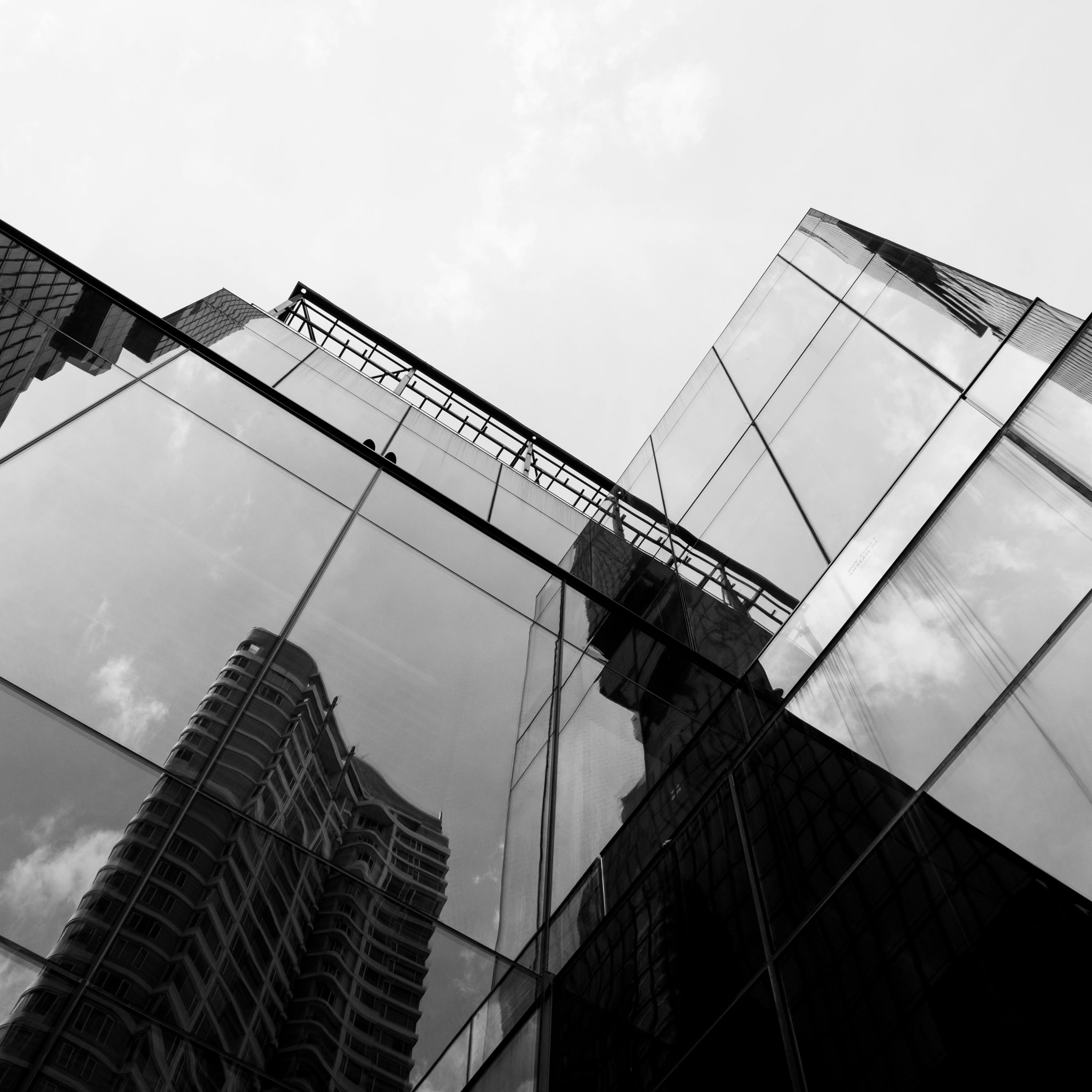 Grayscale Photo of High Rise Glass Buildings · Free Stock Photo
